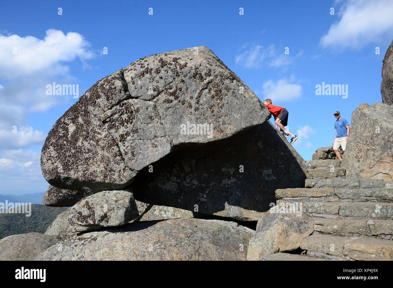 Young boy climbing rock on at Sharp Top Mountain, the Peaks Of Otter ...