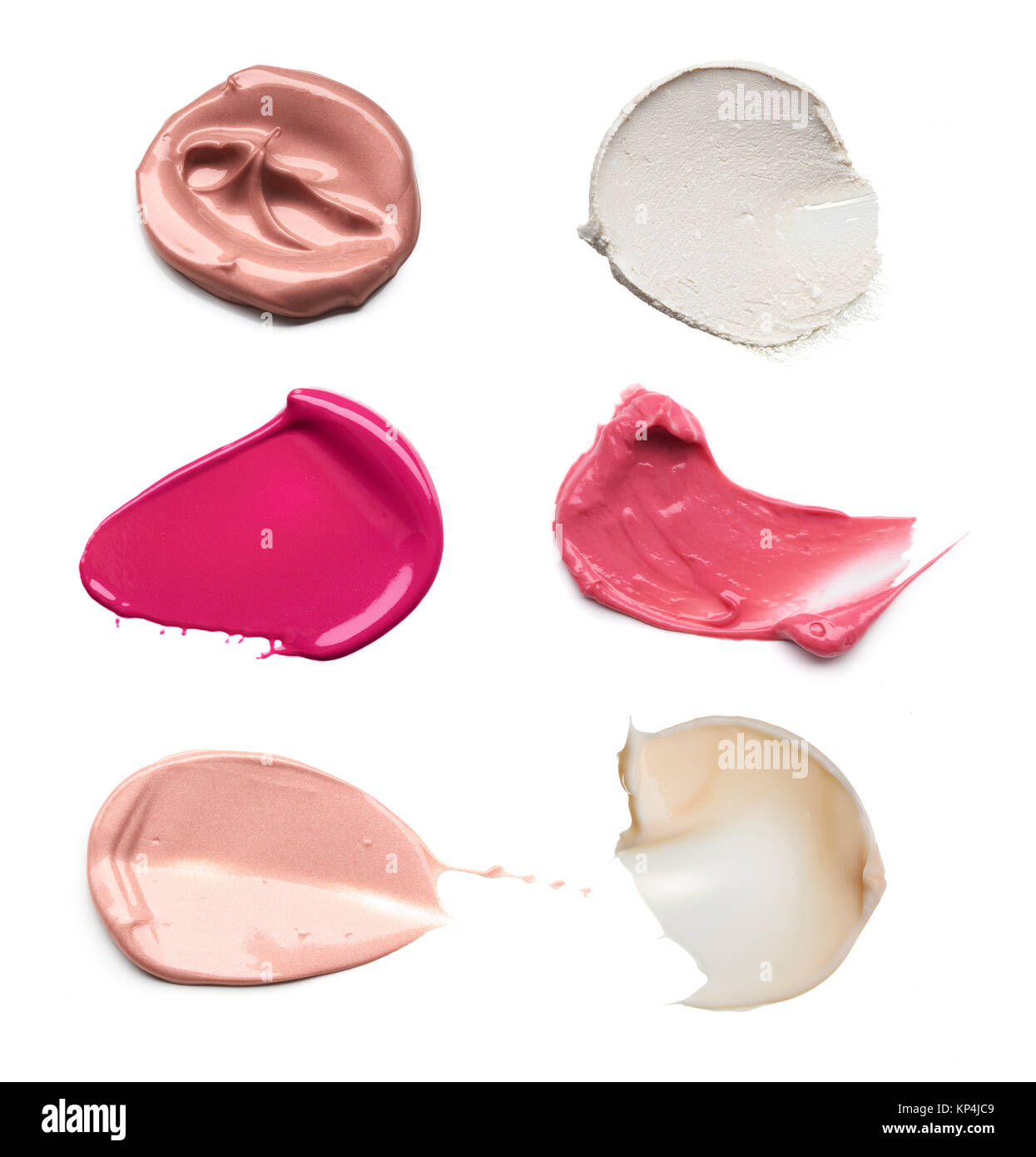 set of smears from various cosmetic products on a white background ...