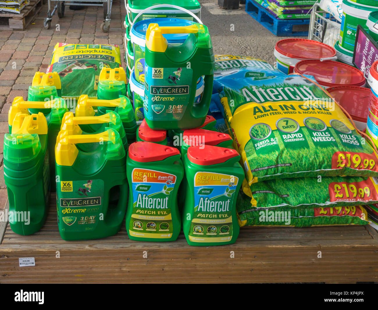 Display of products for improving grass lawns in a garden centre Stock ...