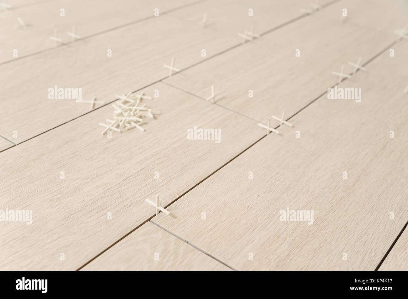 Plastic crosses installed in the space between tiles for equality row ...