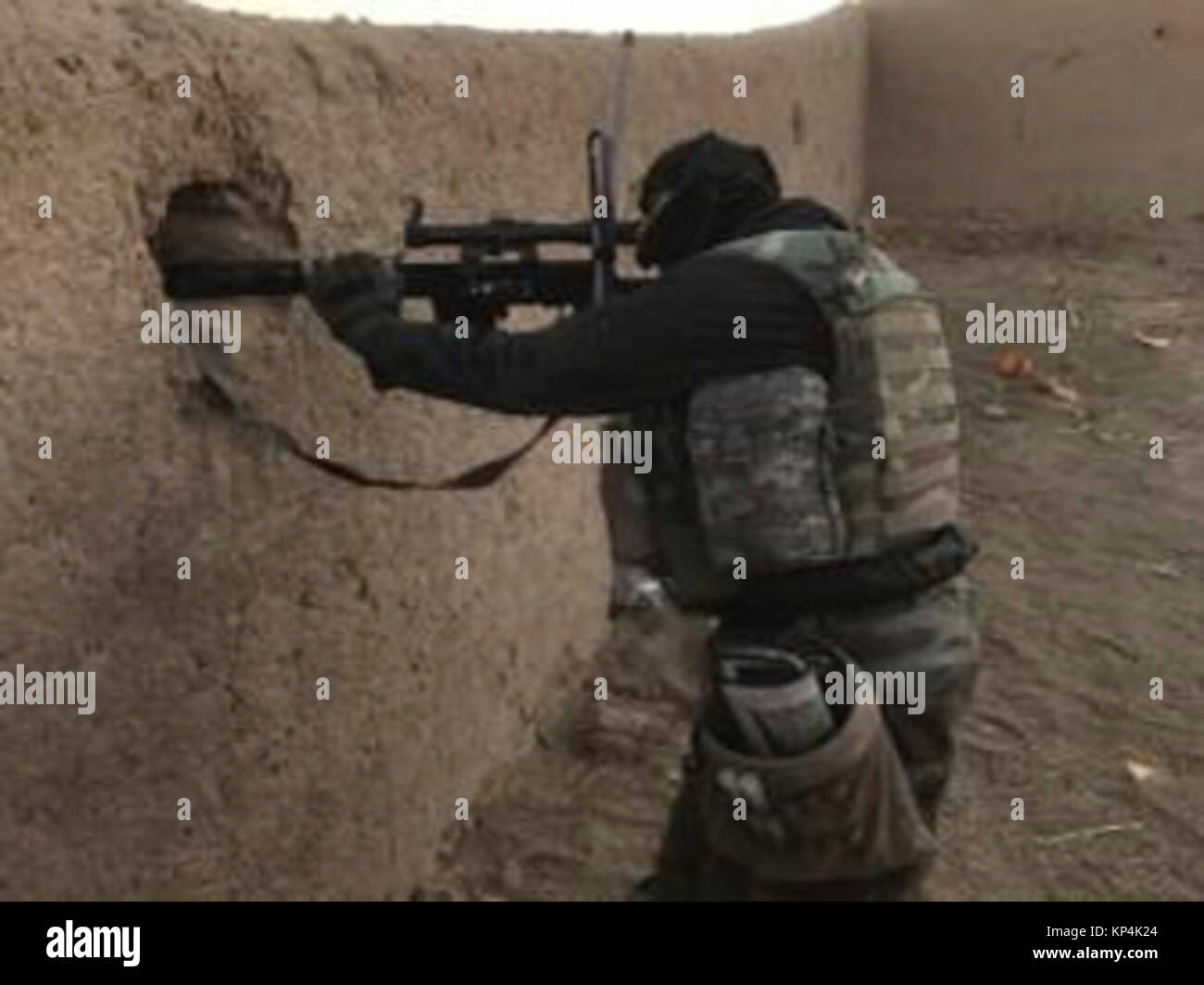 An Afghan Commando sniper searches for enemy during an offensive ...