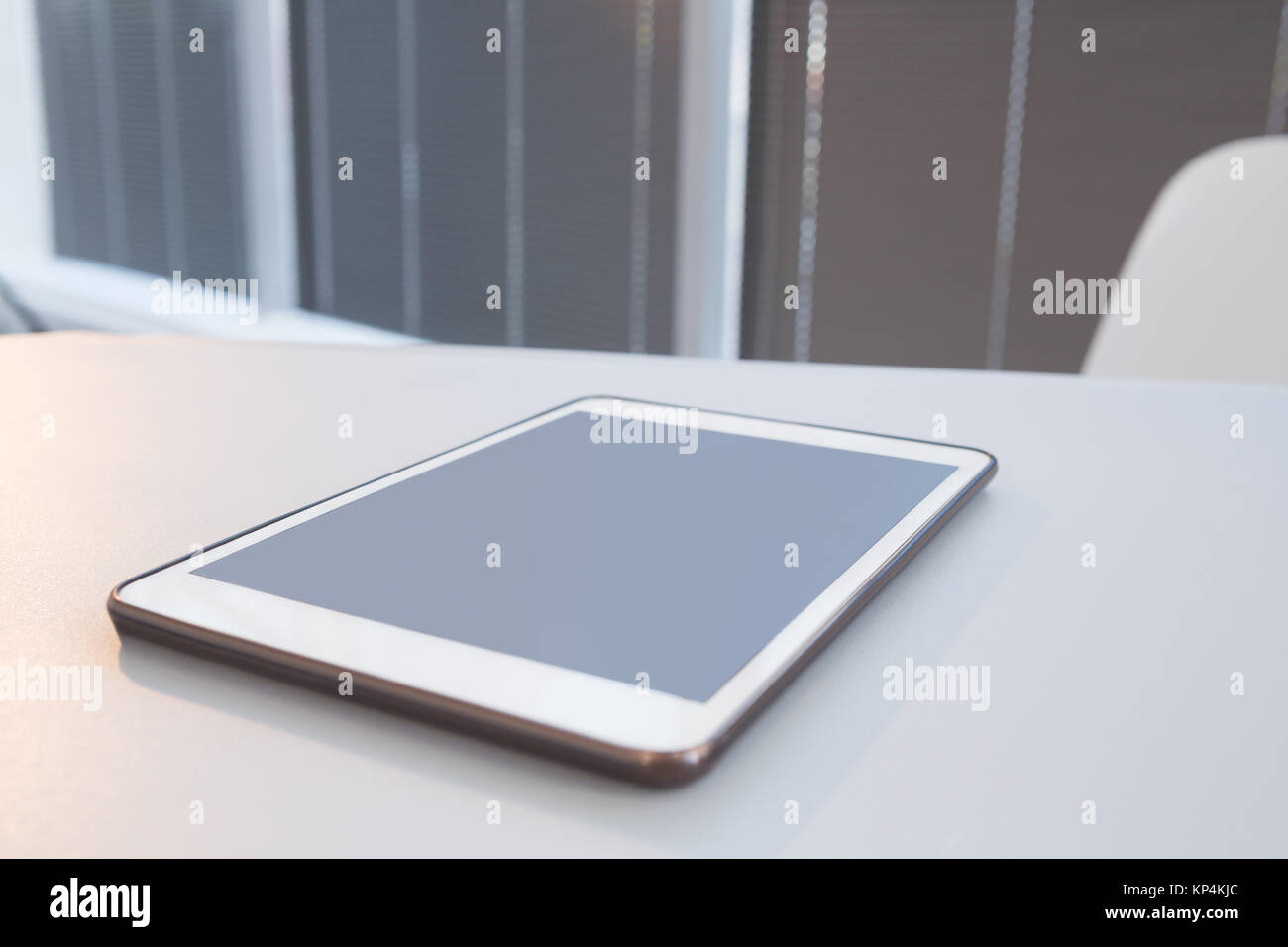 Close-up of digital tablet on desk in office Stock Photo - Alamy