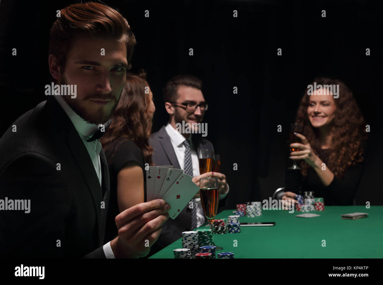 Lucky man with the winning combination of cards Stock Photo - Alamy