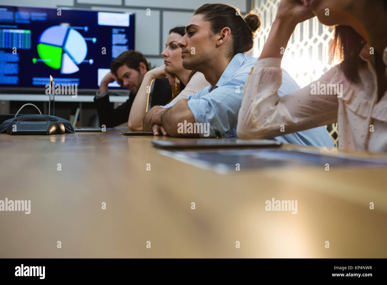 Business colleagues relaxing in conference room at office Stock Photo ...