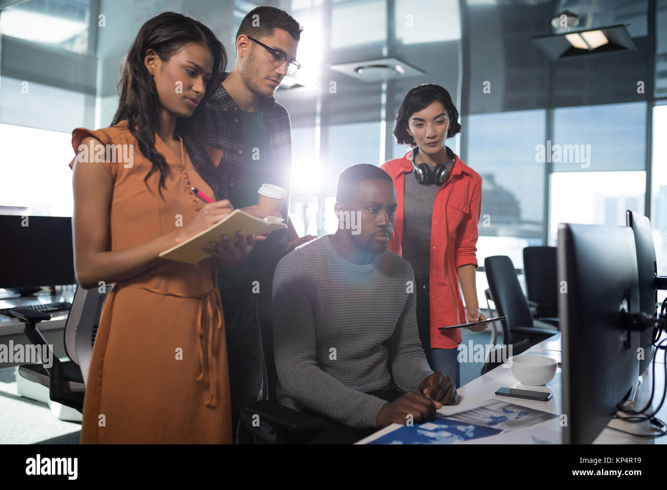 Business executives working at desk in office Stock Photo - Alamy