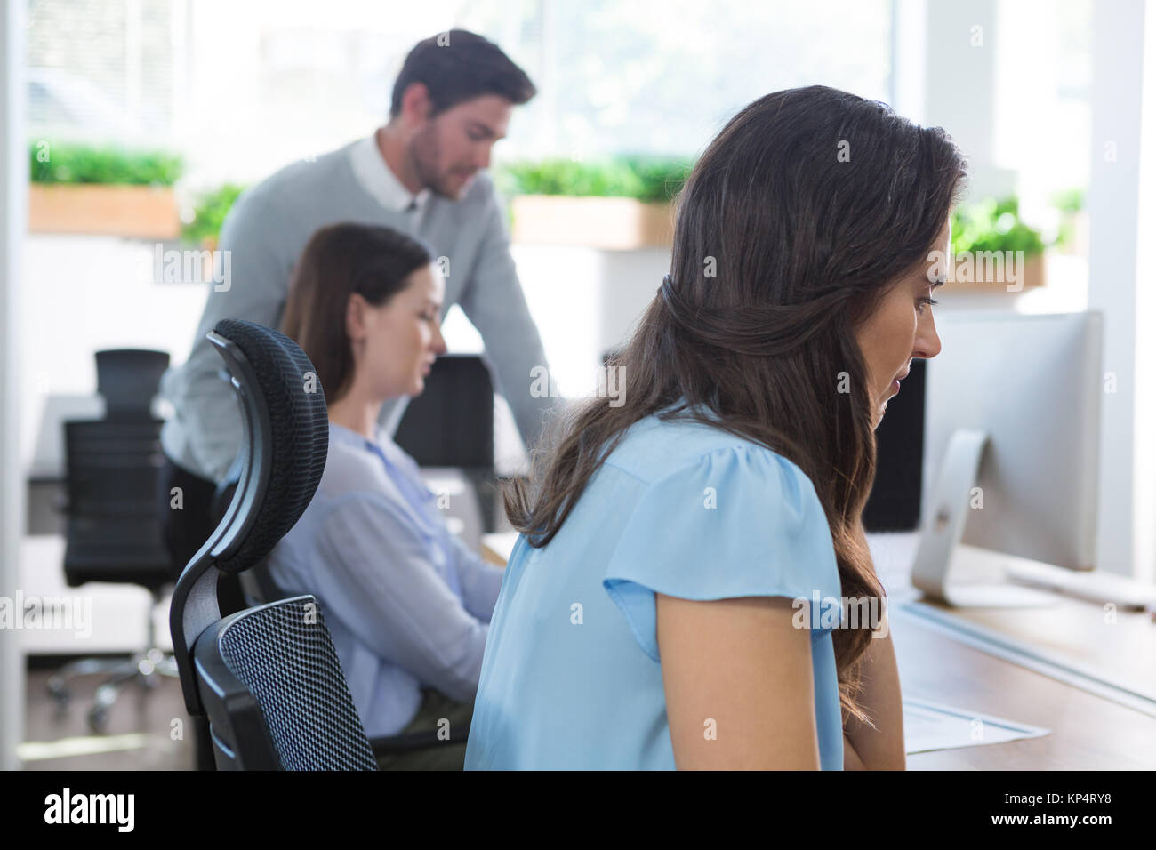 Side view of executive working in the office Stock Photo - Alamy