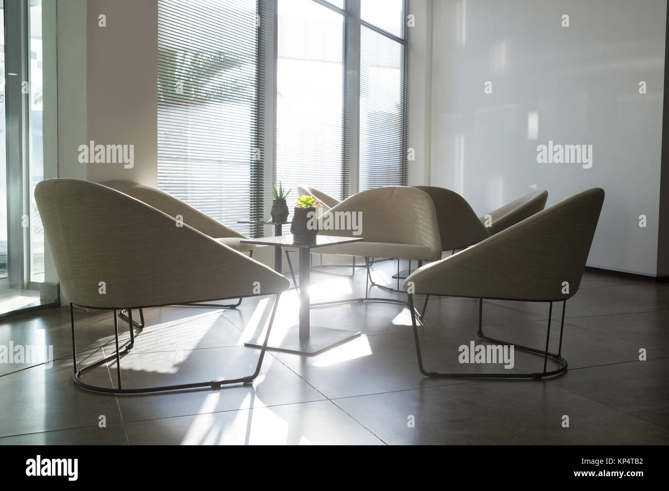 Empty chairs in the sitting area at office Stock Photo - Alamy