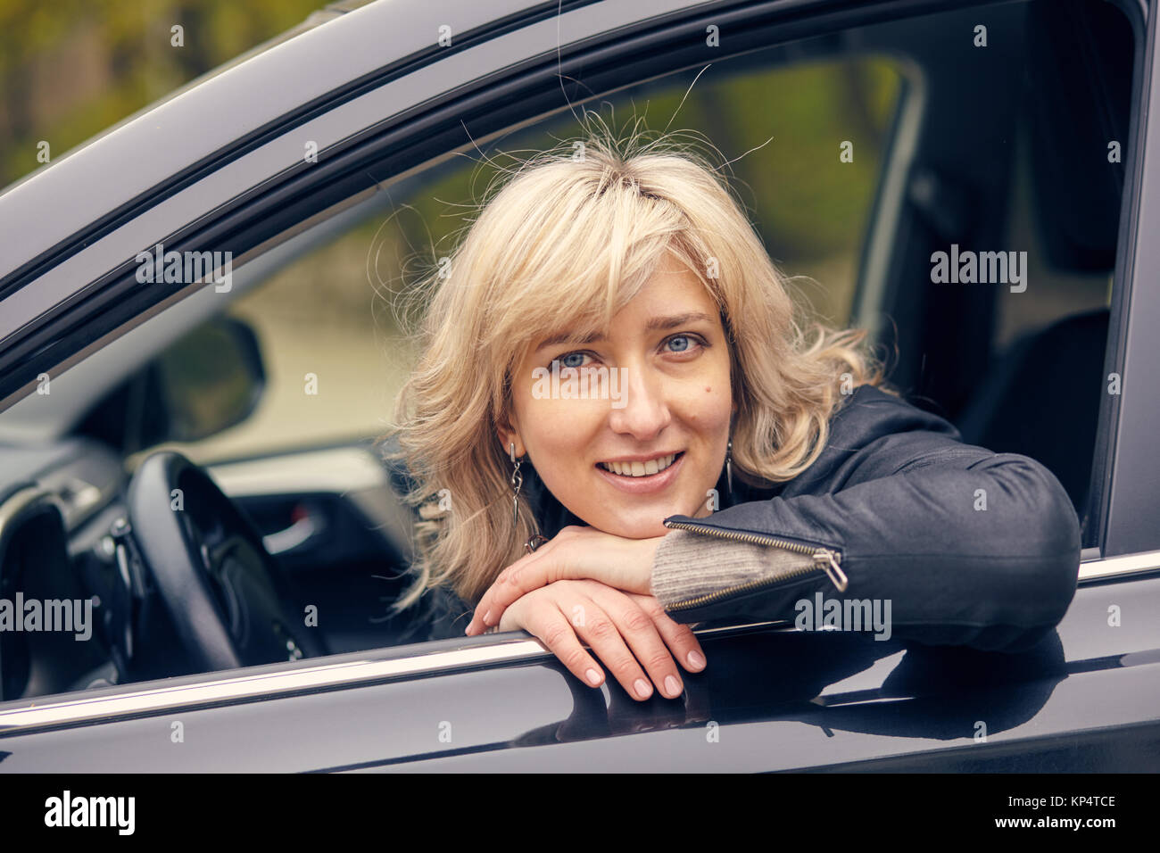 Woman in car Stock Photo - Alamy