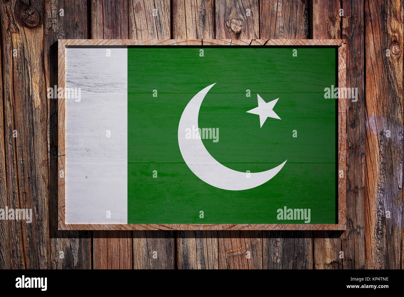 3d rendering of Pakistan flag on a wooden frame over a planks wall ...