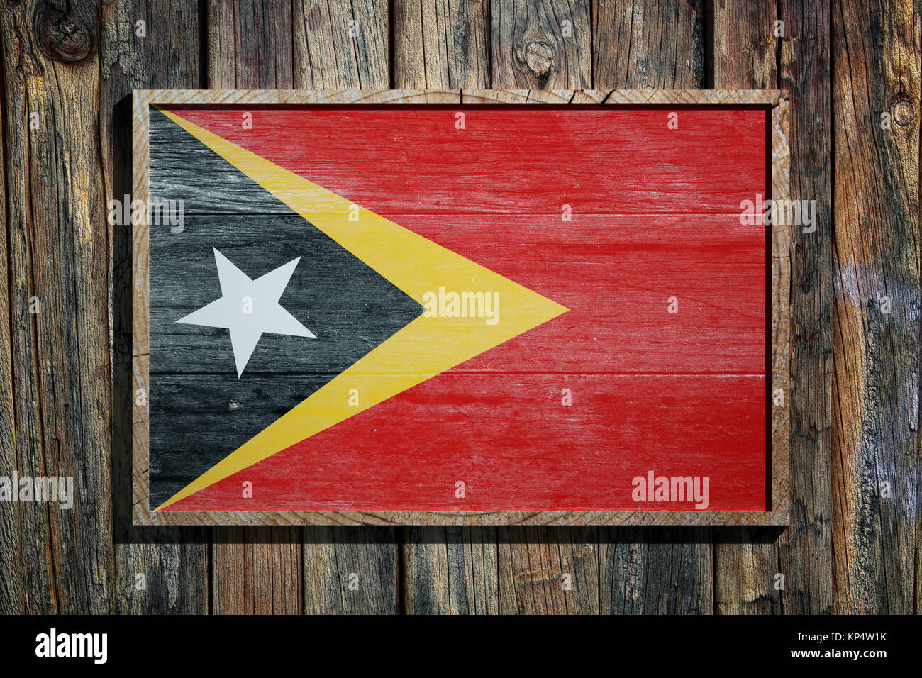 3d rendering of Timor-Leste flag on a wooden frame over a planks wall ...