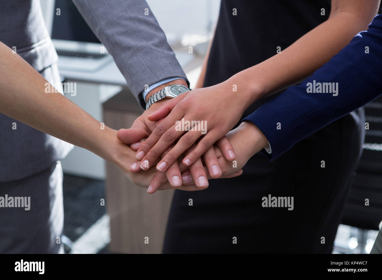 Group business executives hand stack hi-res stock photography and ...