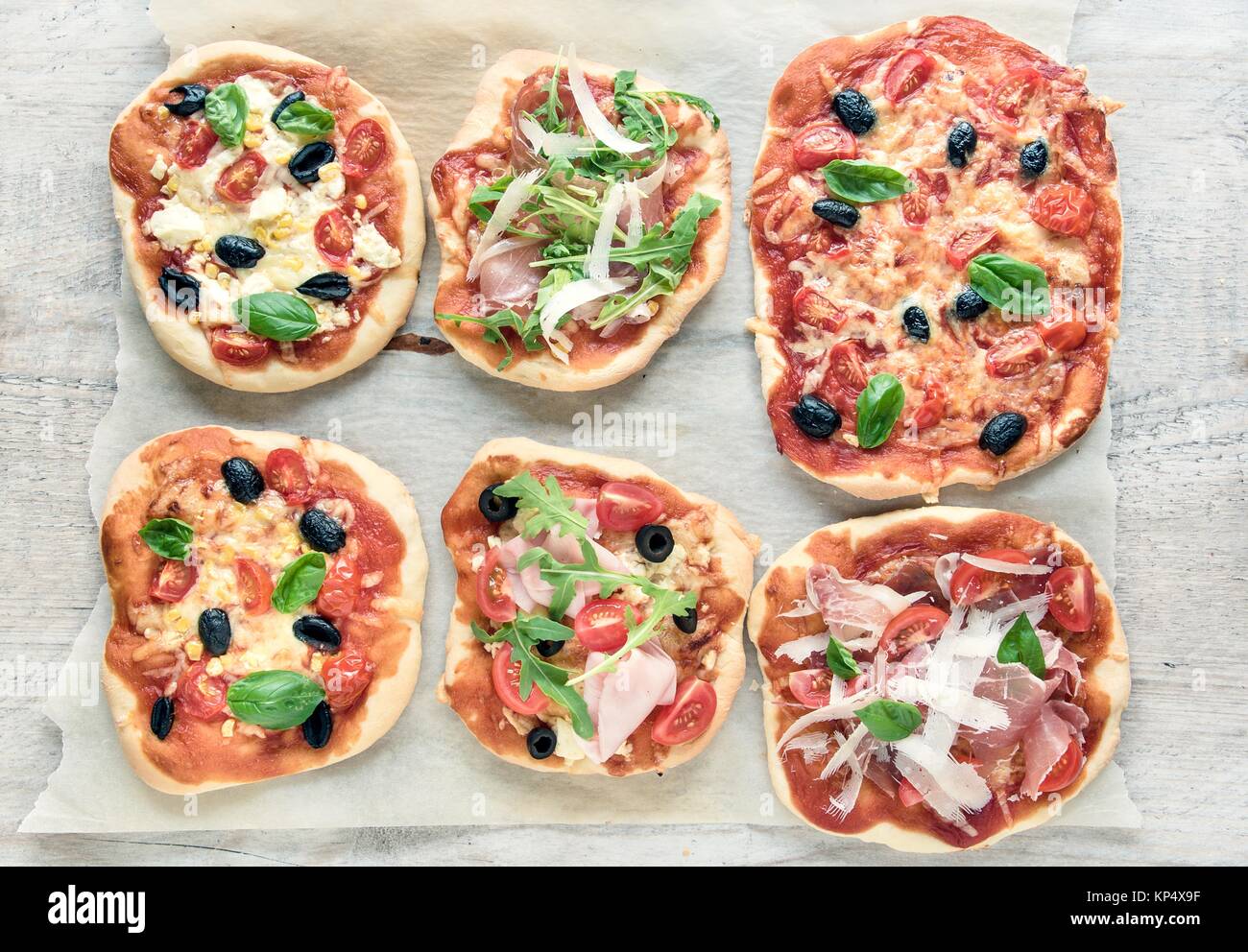 variety of small pizzas Stock Photo - Alamy