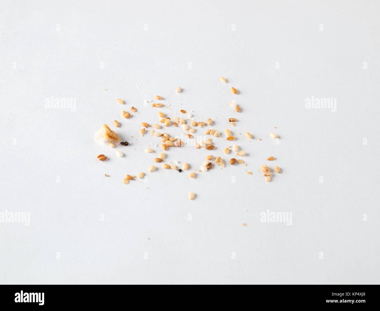 Scattered sesame seeds and crumbs isolated on white background Stock ...