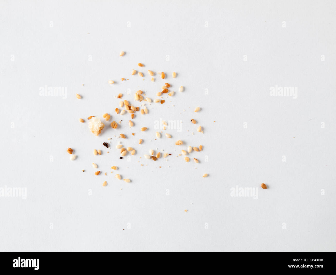 Scattered sesame seeds and crumbs isolated on white background Stock ...
