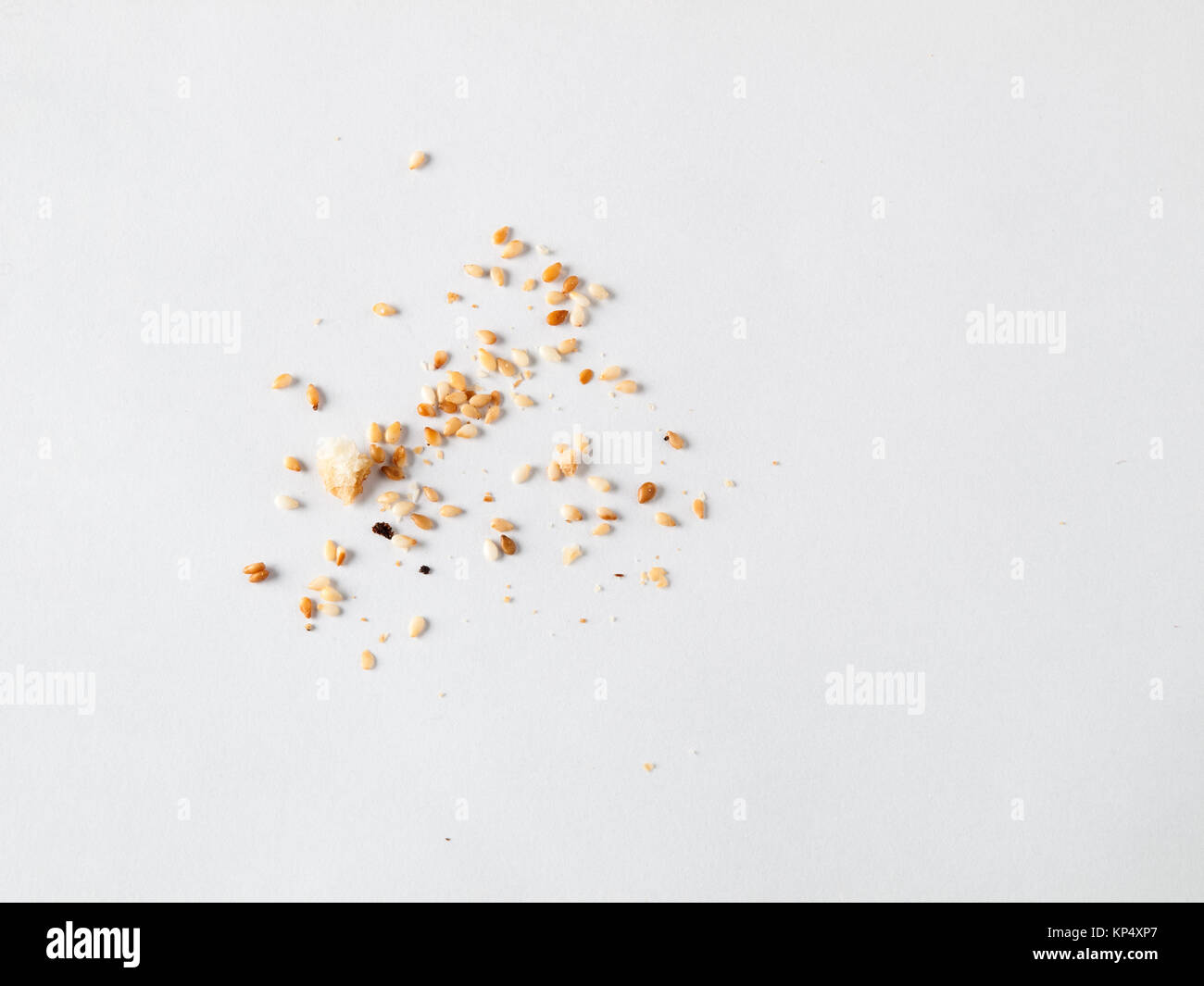 Scattered sesame seeds and crumbs isolated on white background Stock ...