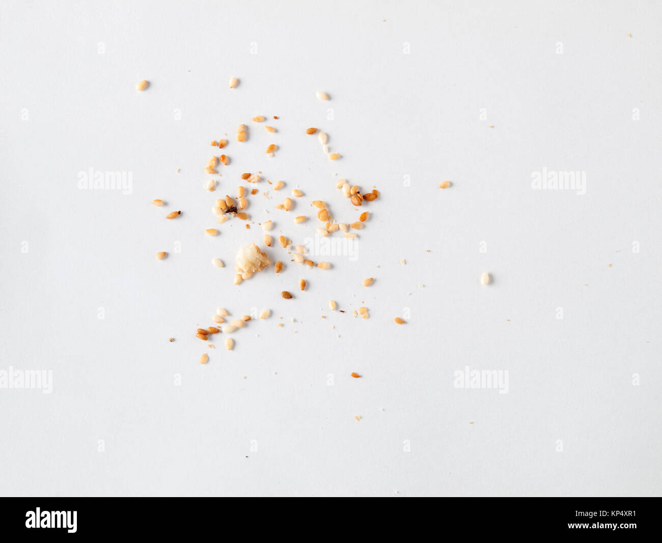 Scattered sesame seeds and crumbs isolated on white background Stock ...