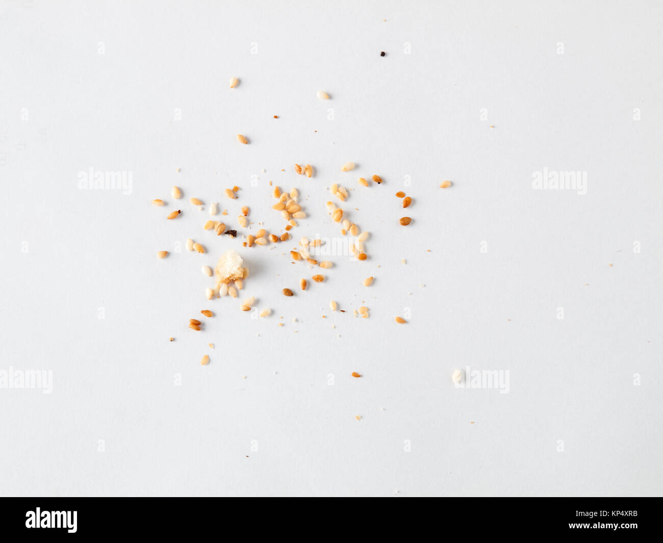 Scattered sesame seeds and crumbs isolated on white background Stock ...