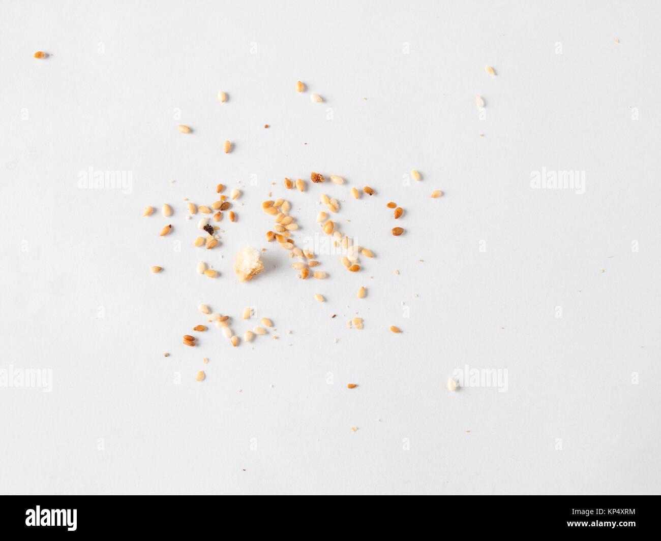 Scattered sesame seeds and crumbs isolated on white background Stock ...