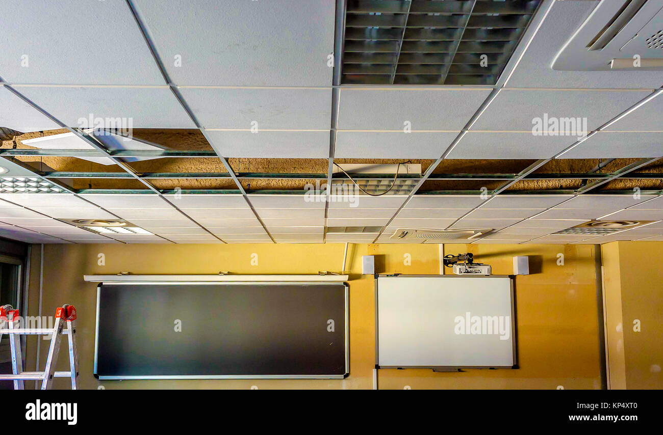 view of a classroom ceiling to be repaired Stock Photo - Alamy