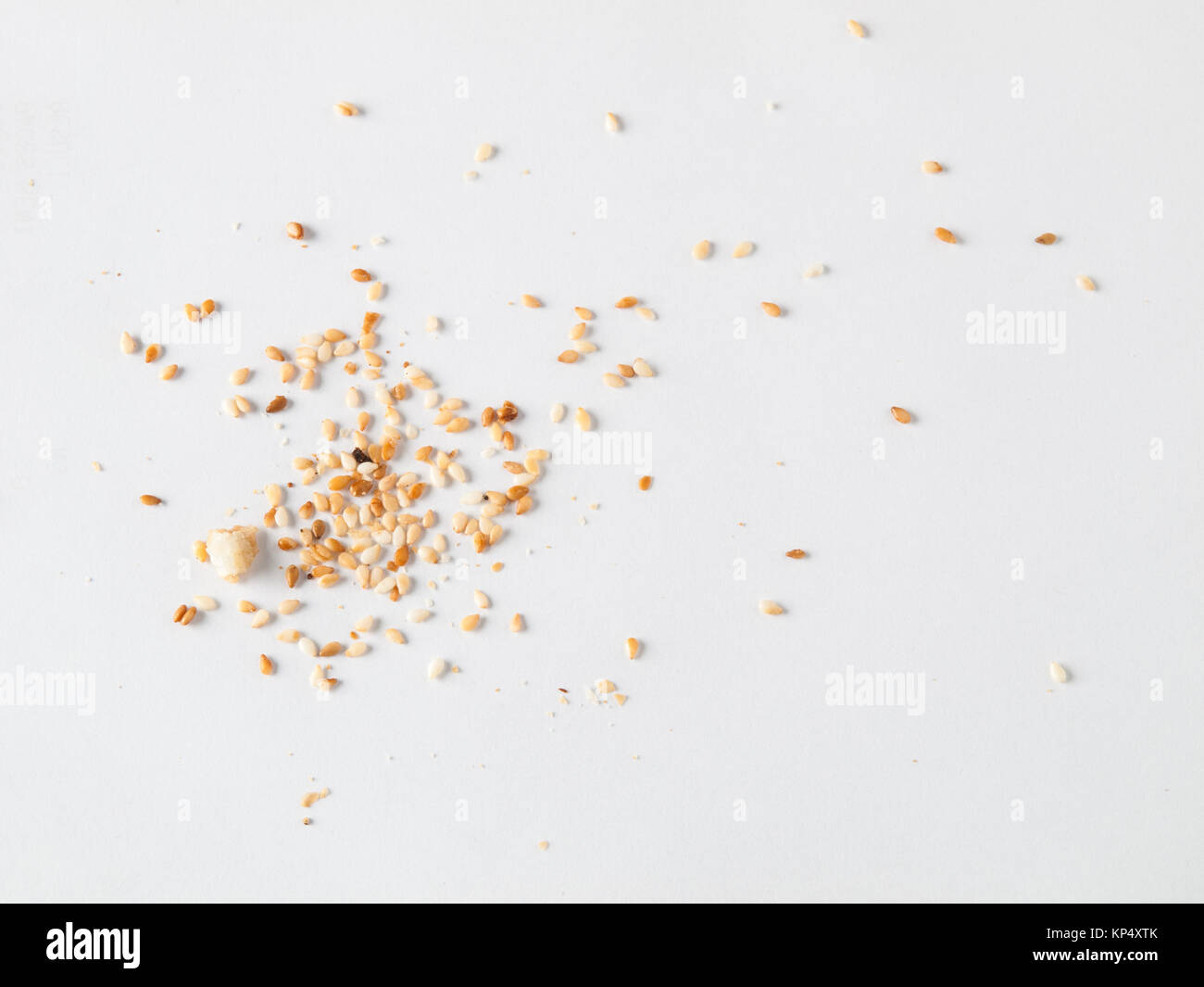 Scattered sesame seeds and crumbs isolated on white background Stock ...