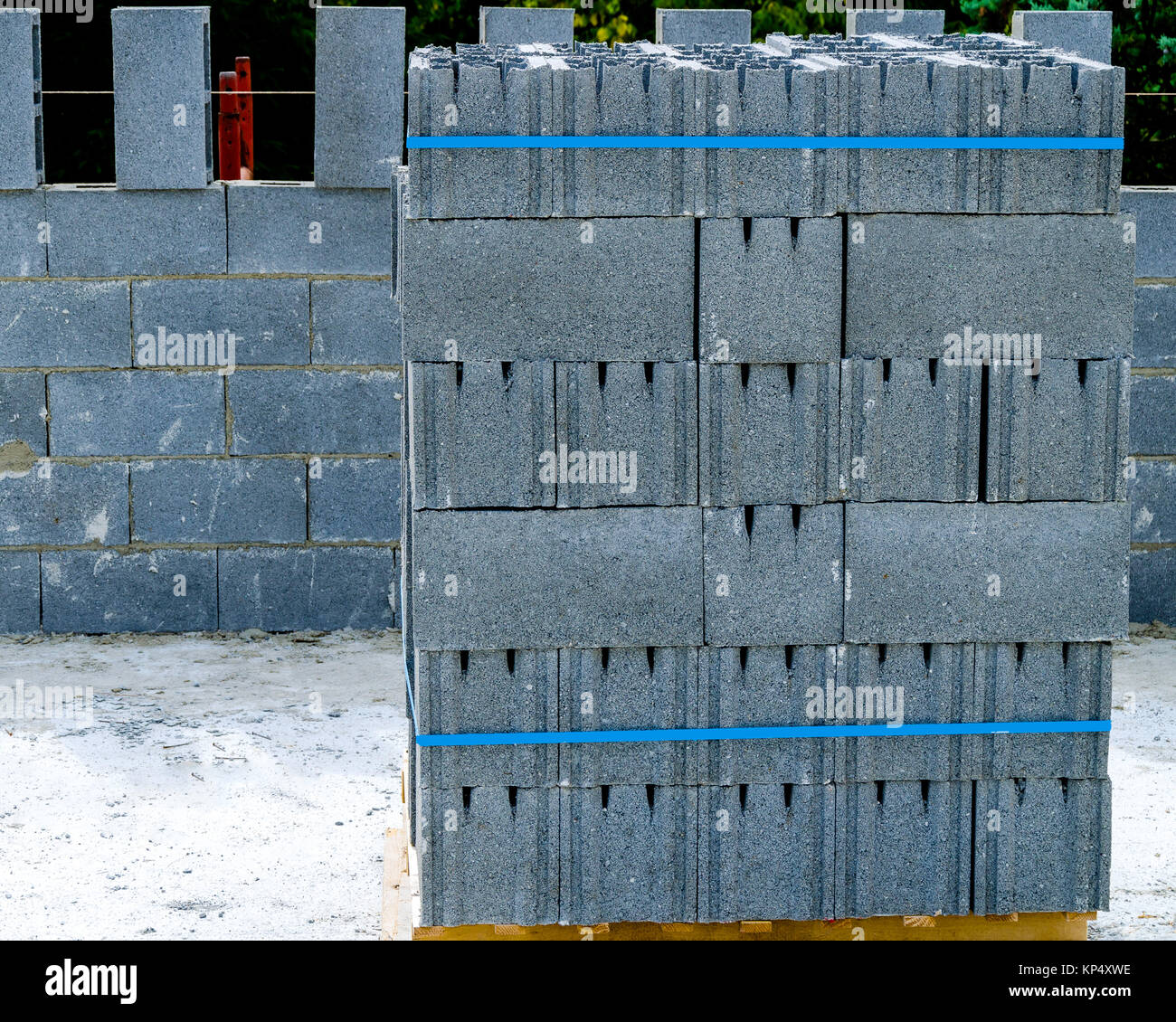 Stack of grey clay brick on pallet of a terace Stock Photo - Alamy