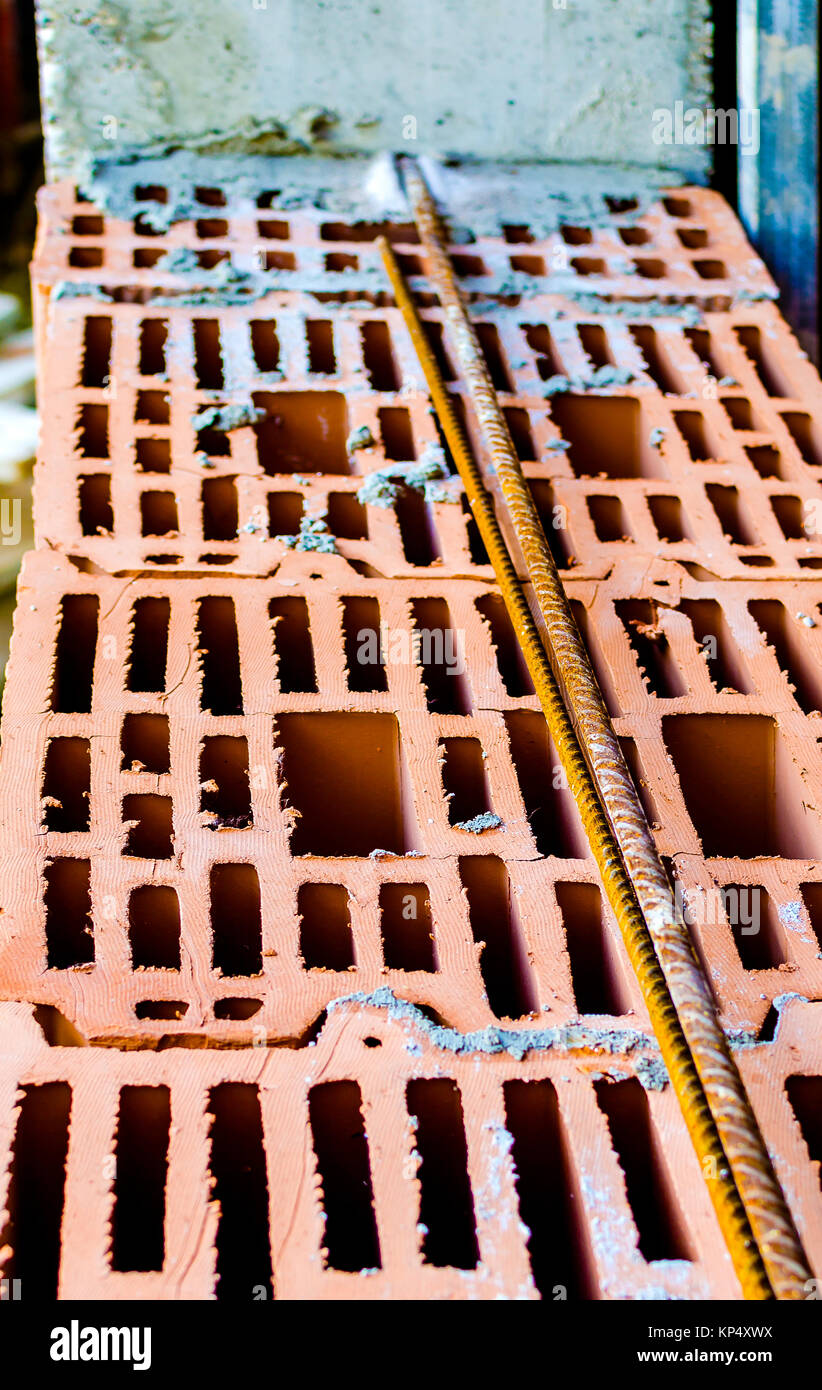 Seismic external masonry reinforcement operation in a building under ...