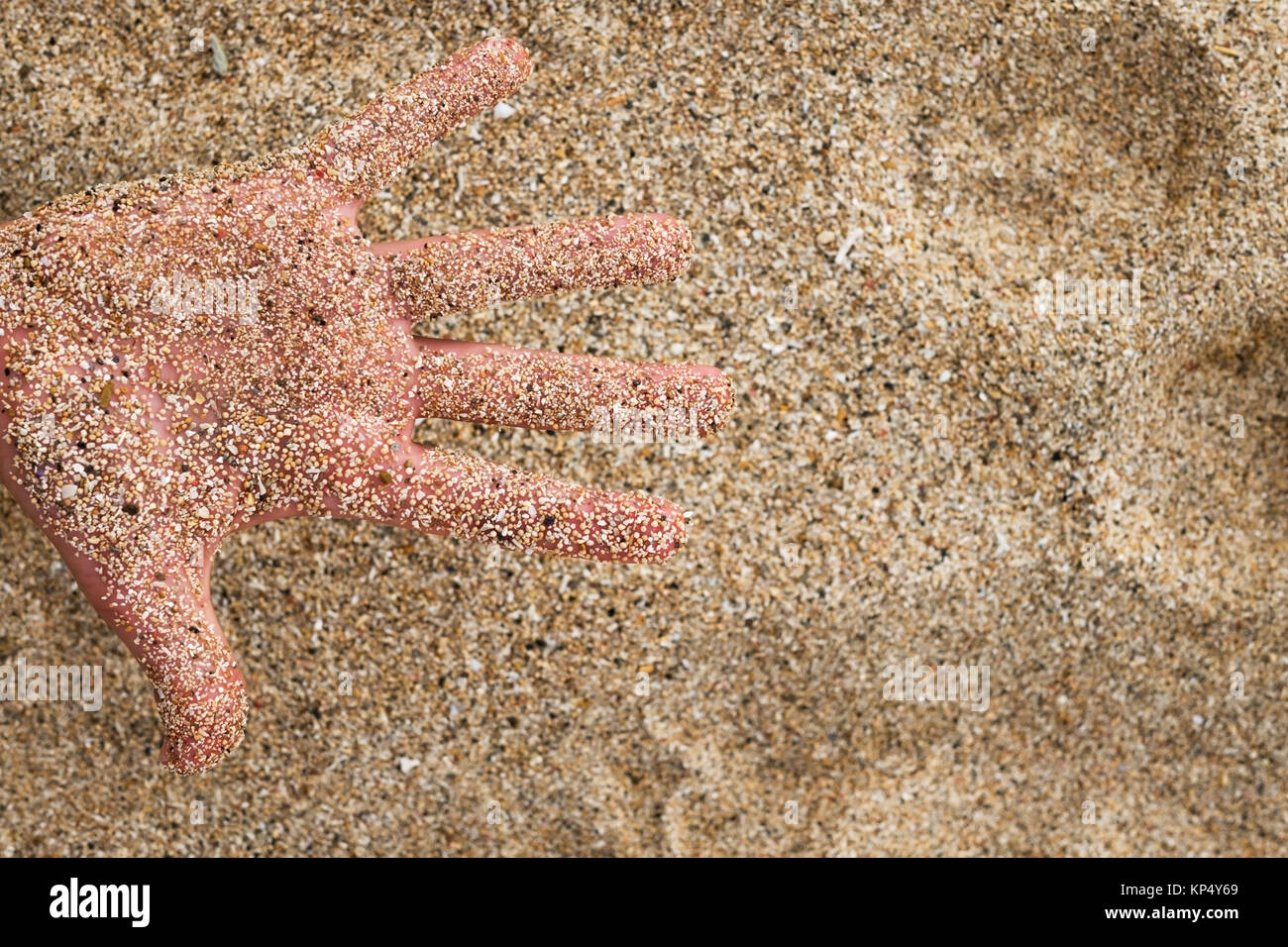 Hand in sand hi-res stock photography and images - Alamy