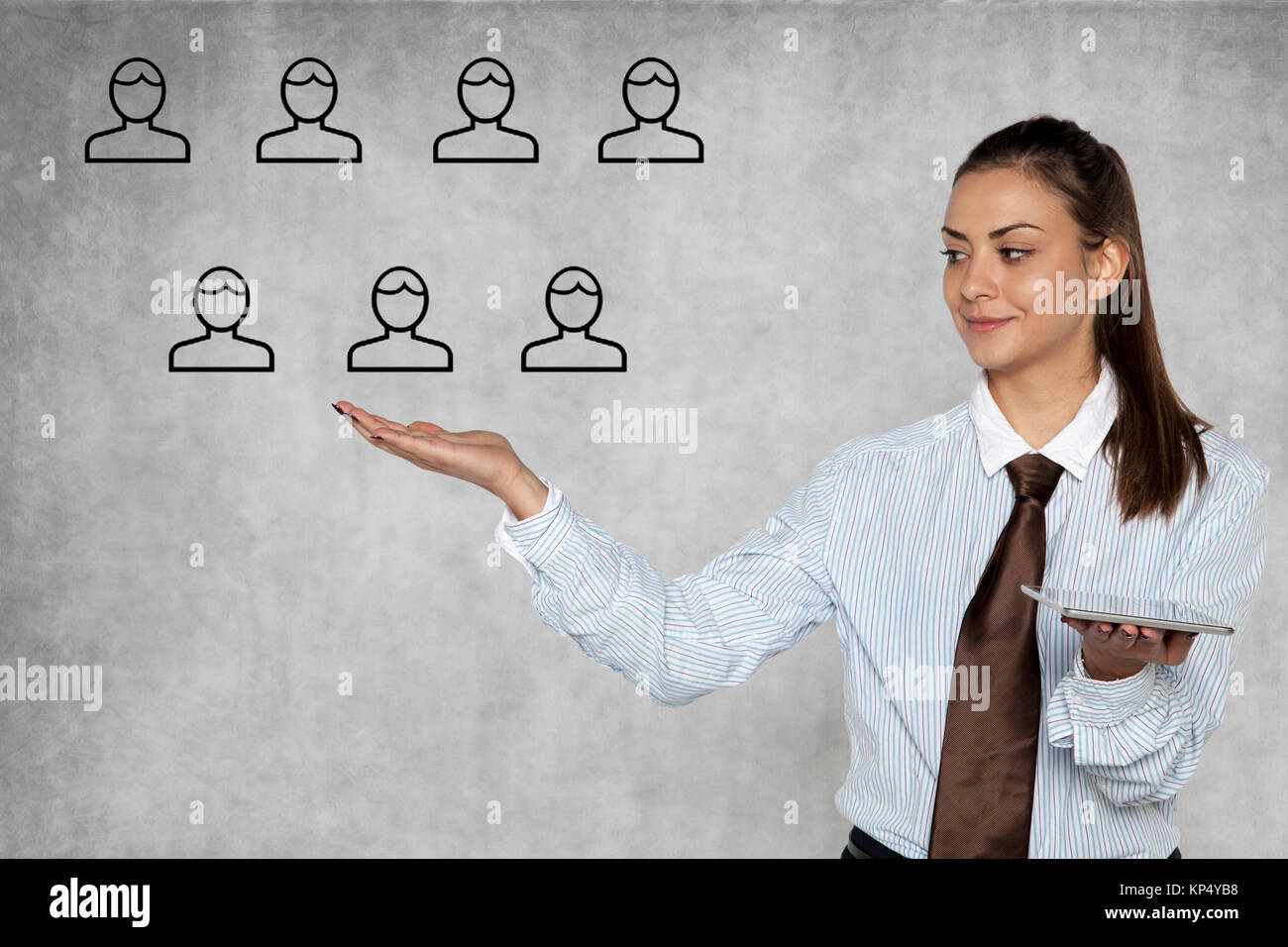 businesswoman shows how to easily manage people Stock Photo - Alamy