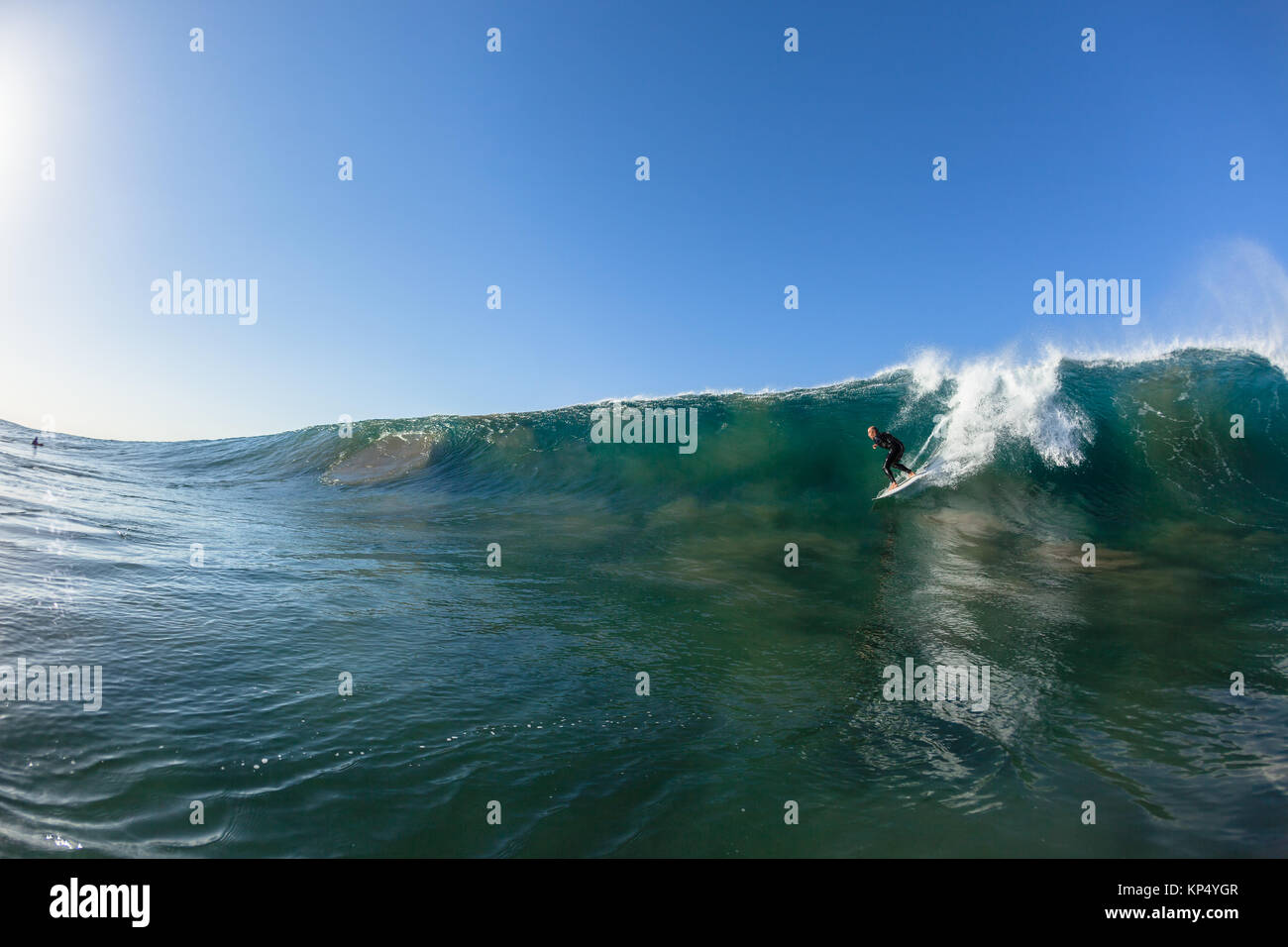 Surfing surfer dropping down vertical ocean wave swimming water photo ...