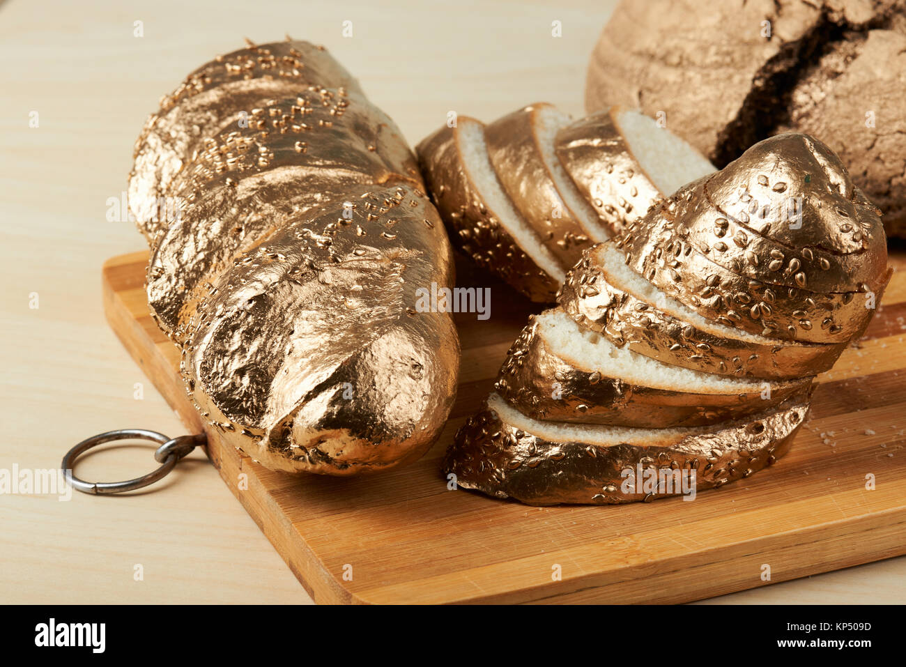 Set of golden bread lay on wood board close up Stock Photo - Alamy