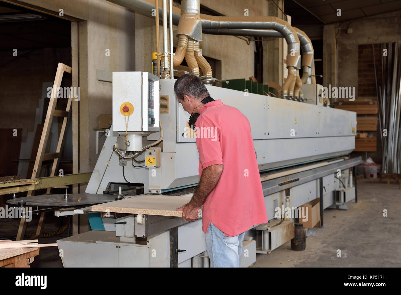 a carpenter who is programming a machine Stock Photo - Alamy