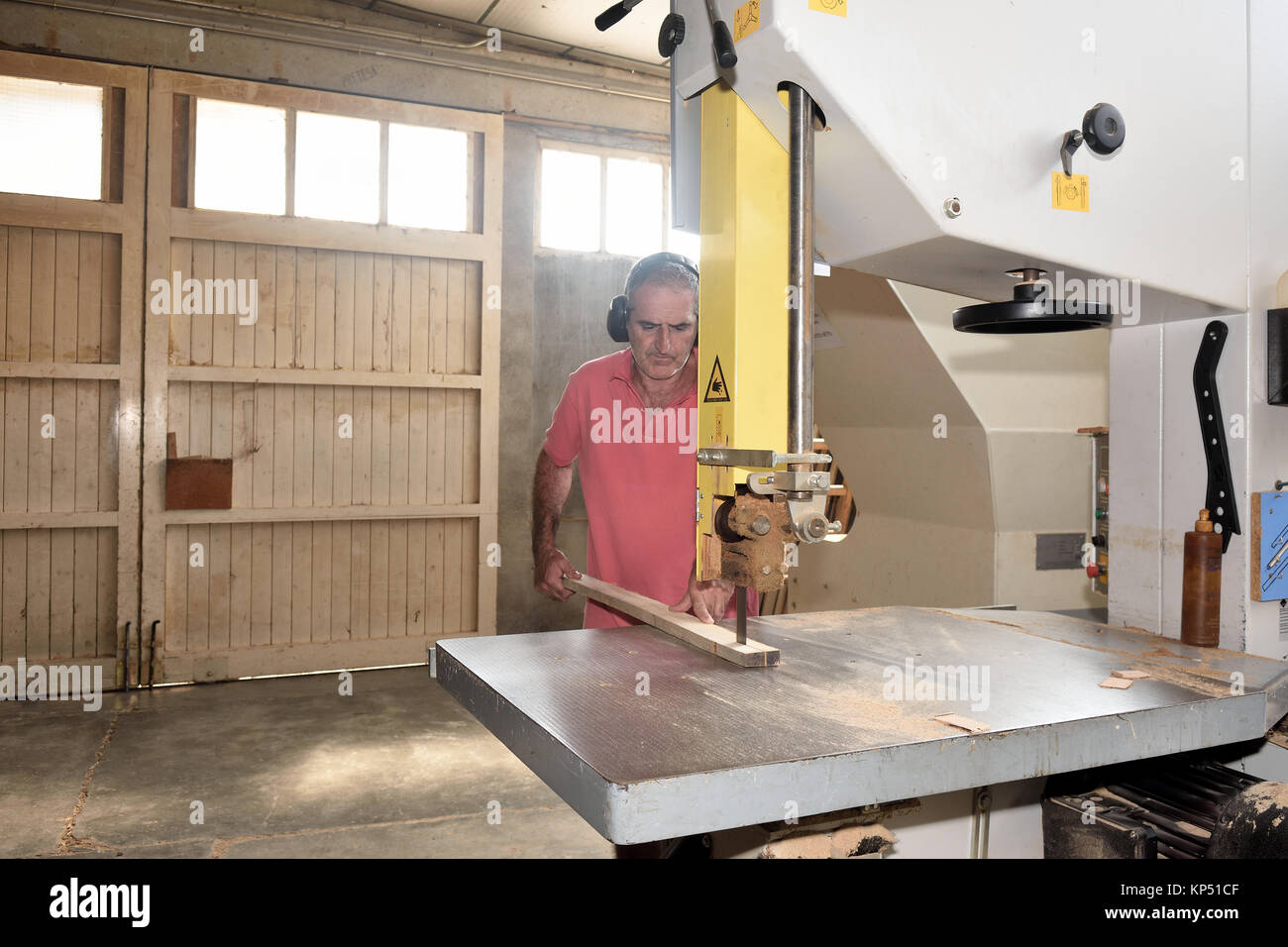 carpenter cutting a wooden board Stock Photo - Alamy