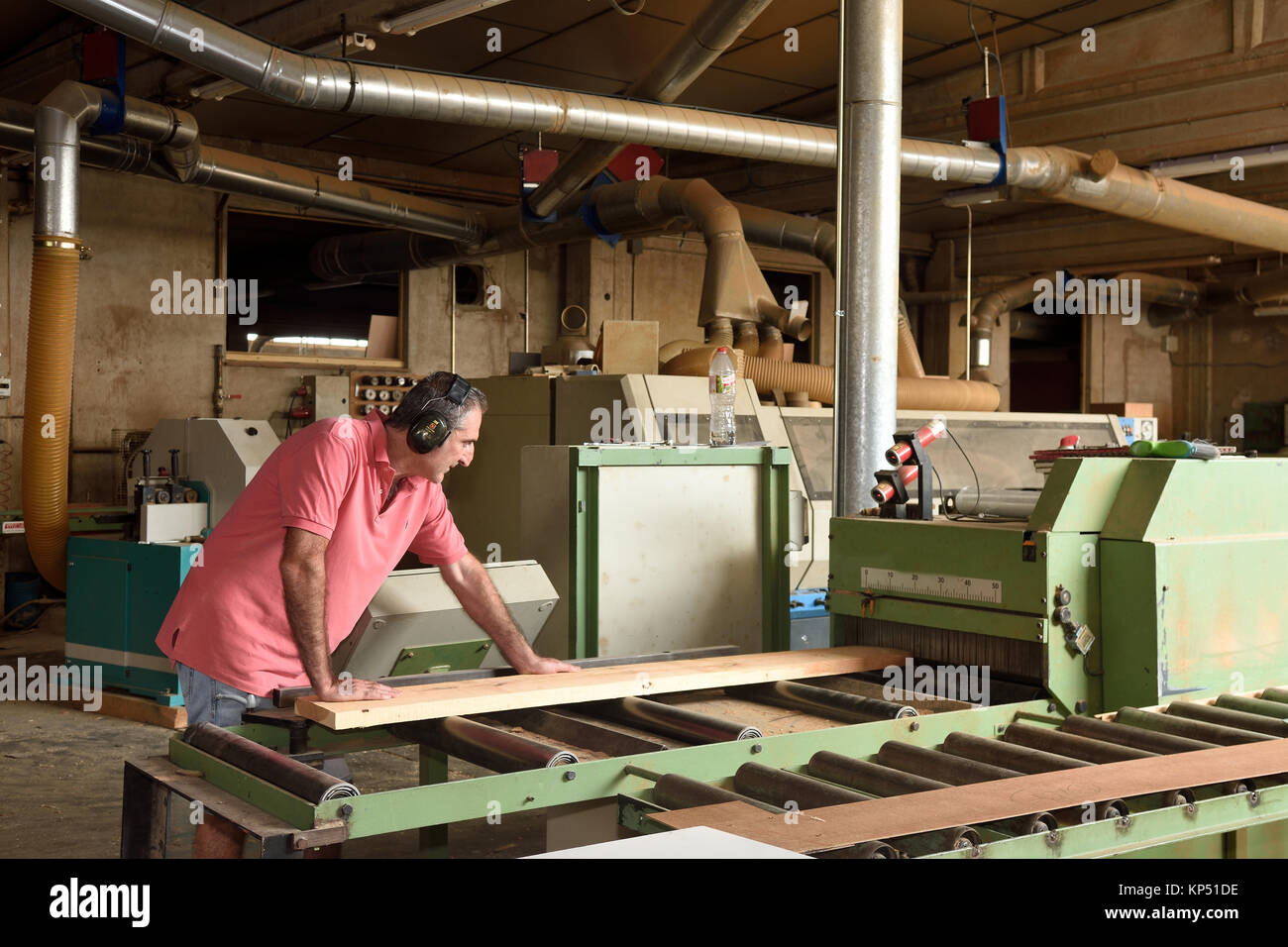 carpenter polishing wood in a carpentry workshop Stock Photo - Alamy