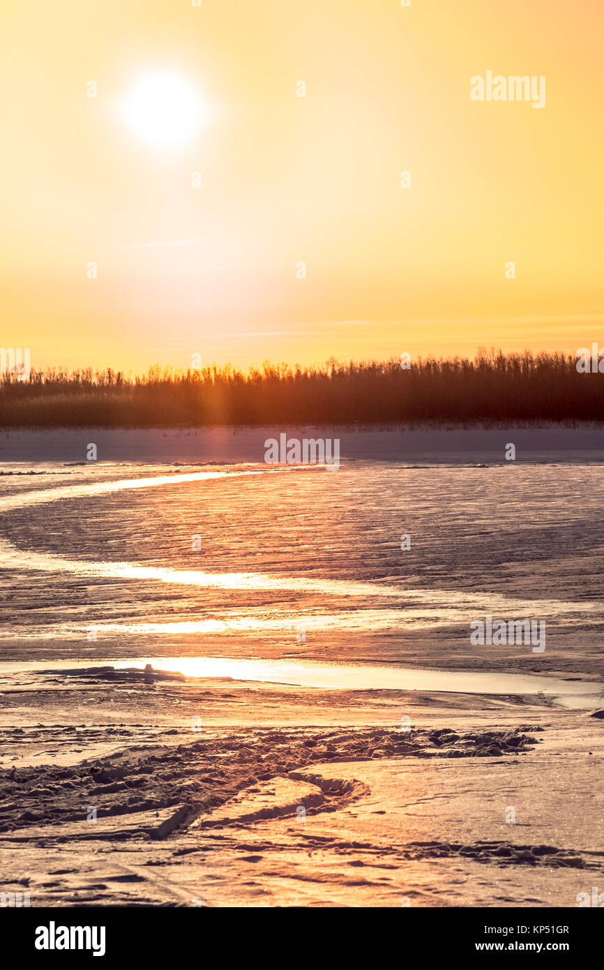 Sunrise over the river covered with ice and snow Stock Photo - Alamy