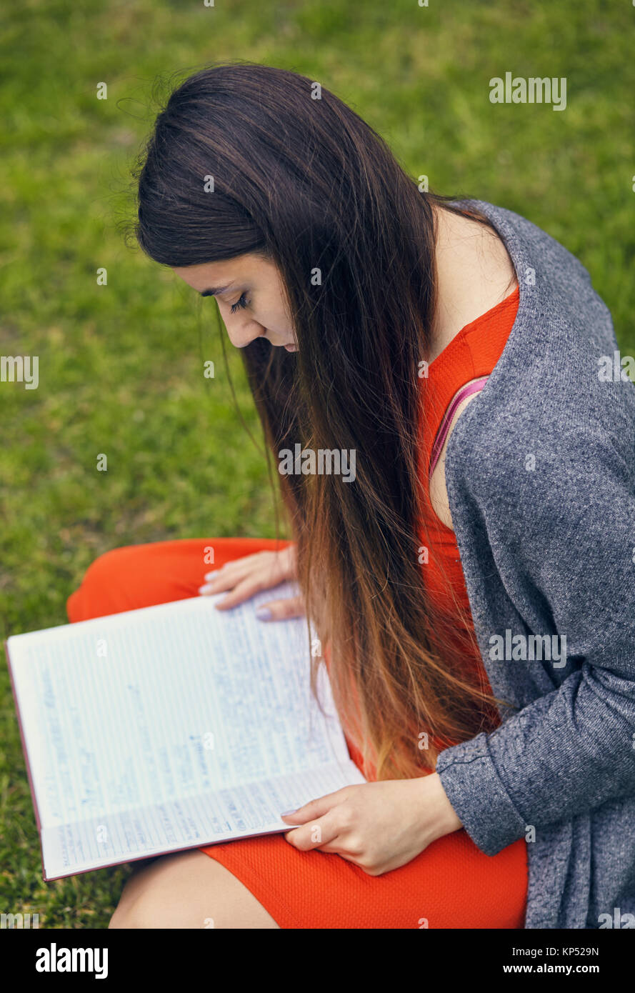 Beautiful woman reading book in nature Stock Photo - Alamy