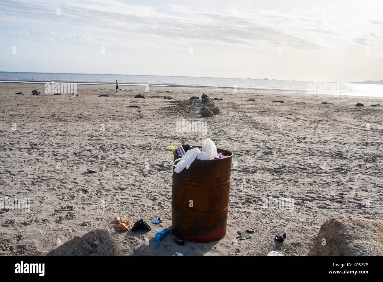 Overflowing rusty bin full of rubbish, waste on the beach, Dollymount ...