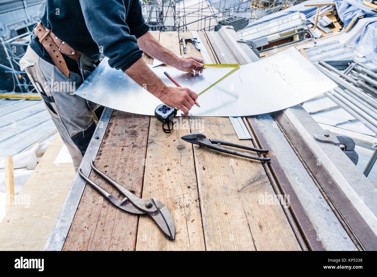 Cutting of zinc plates to cover a roof in Paris, France Stock Photo - Alamy