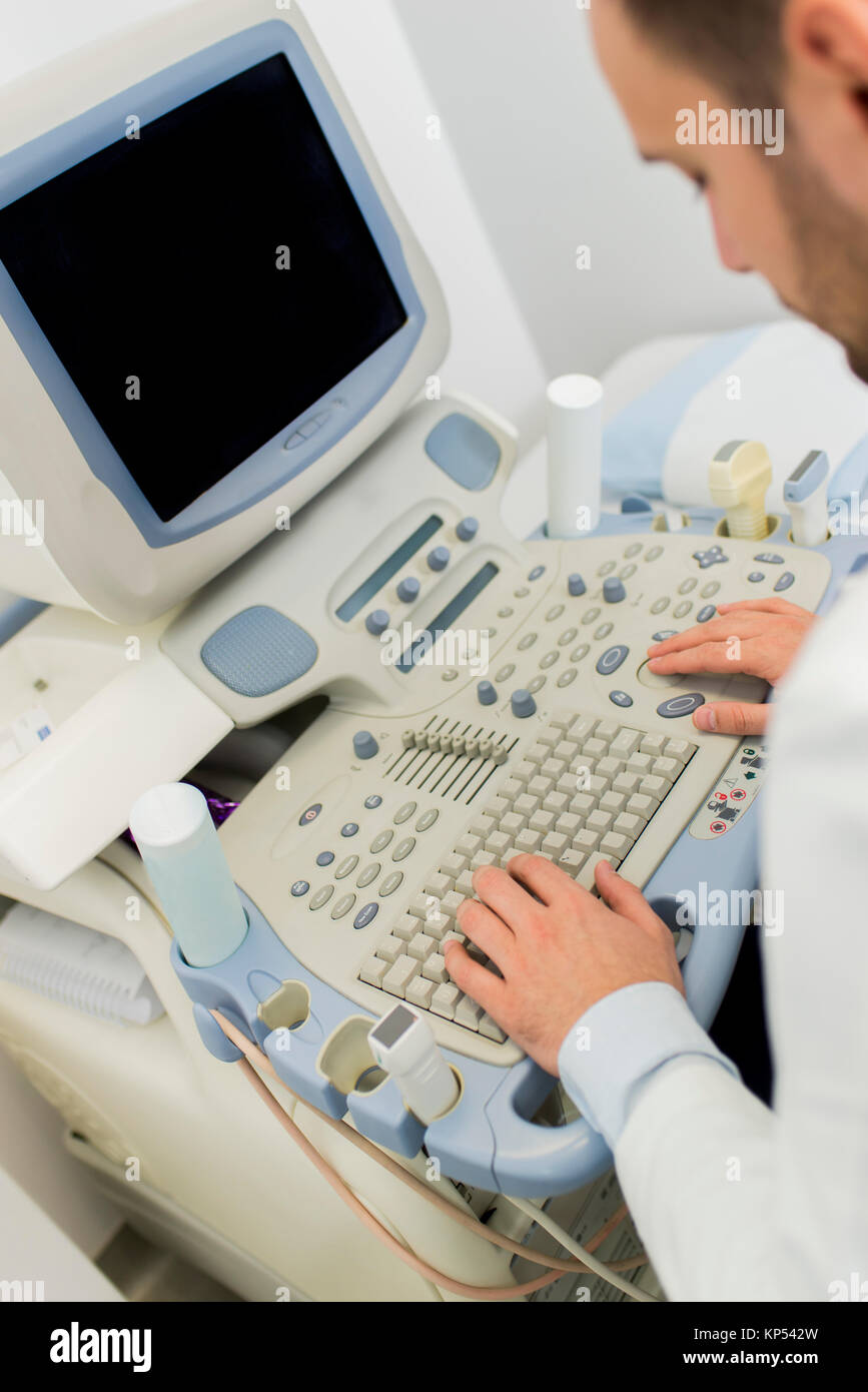 Doctor uses medical machine close hi-res stock photography and images ...