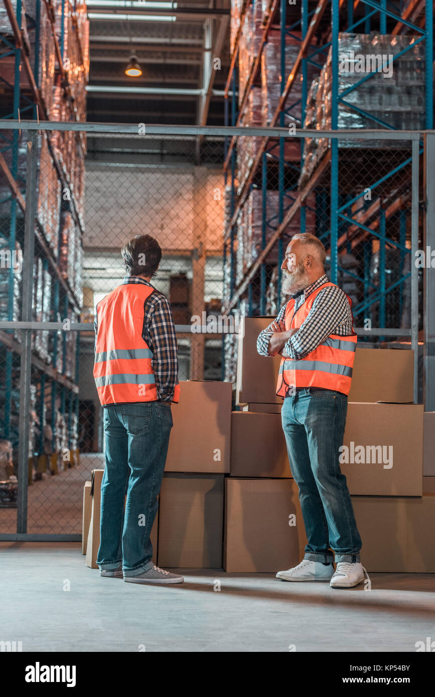 warehouse workers with boxes Stock Photo - Alamy