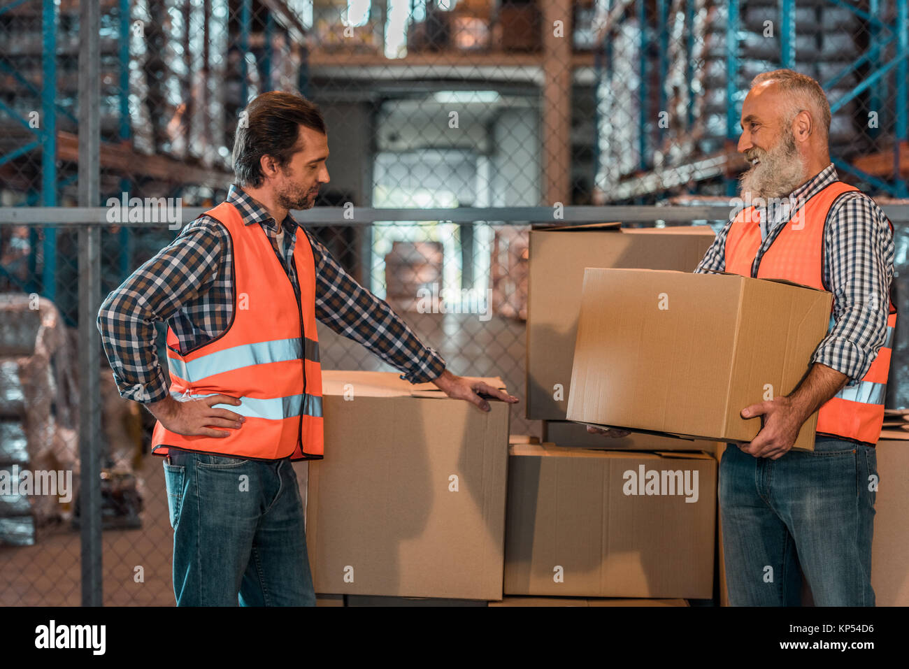 warehouse workers with boxes Stock Photo - Alamy