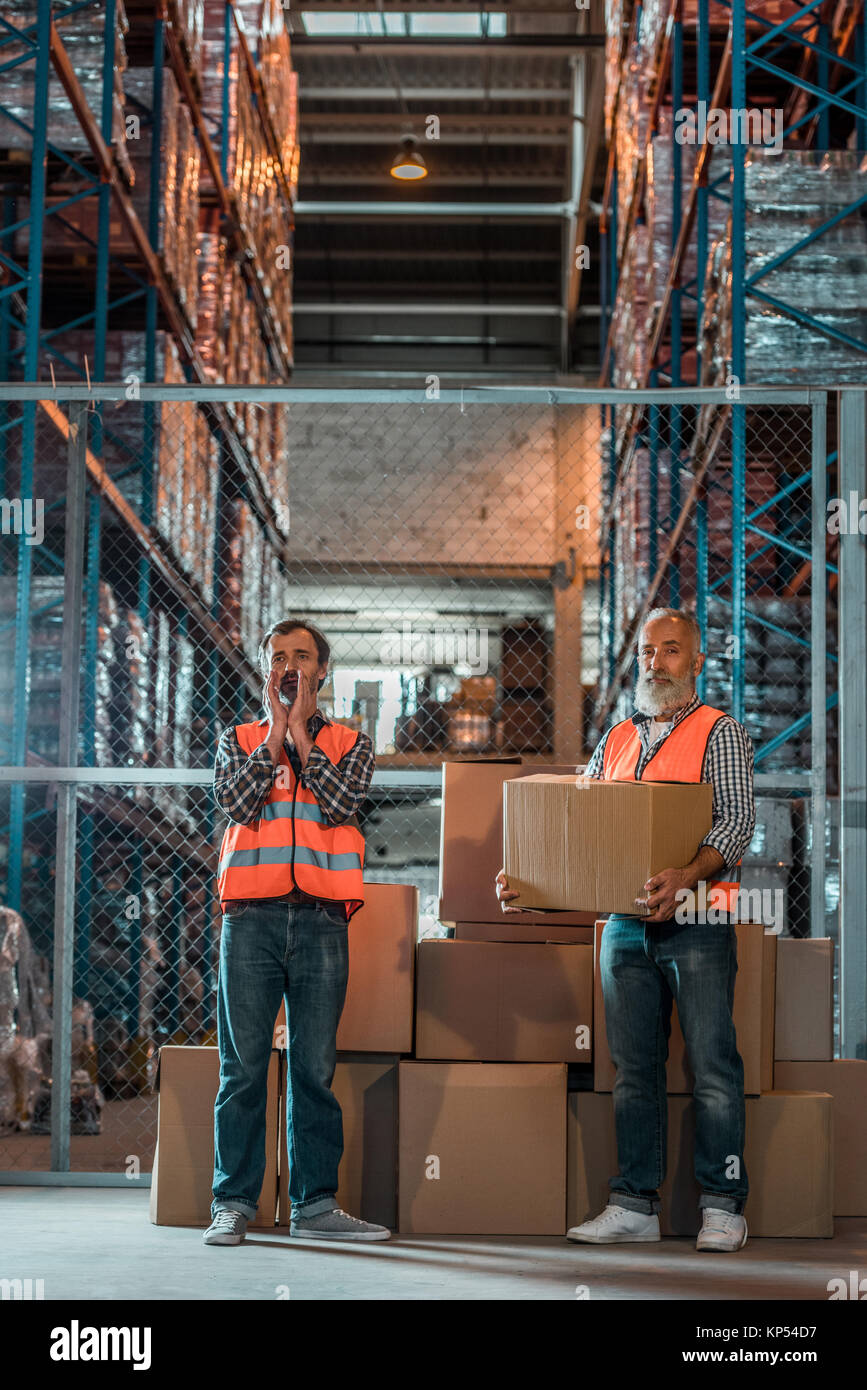 warehouse workers with boxes Stock Photo - Alamy