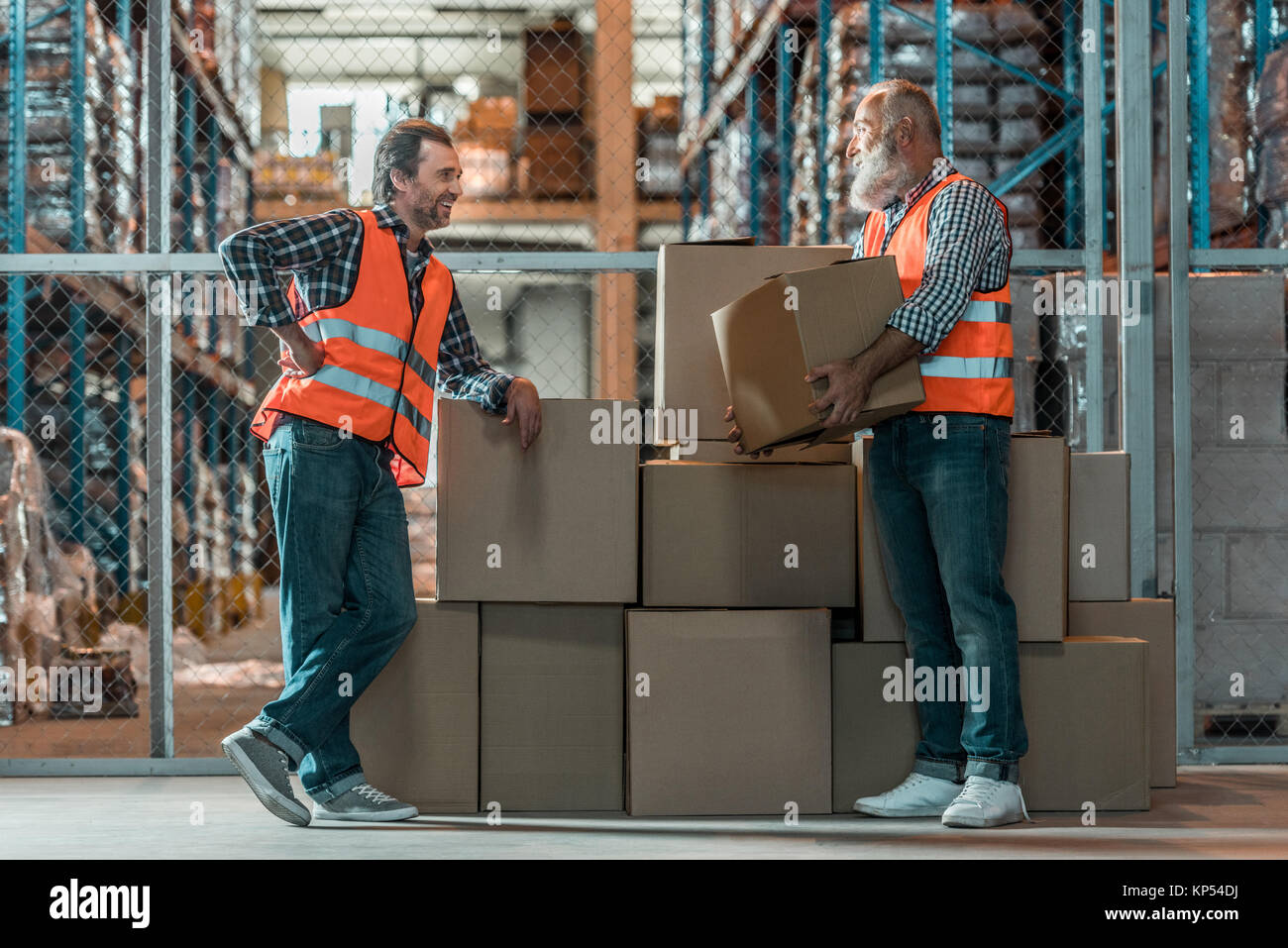 warehouse workers with boxes Stock Photo - Alamy