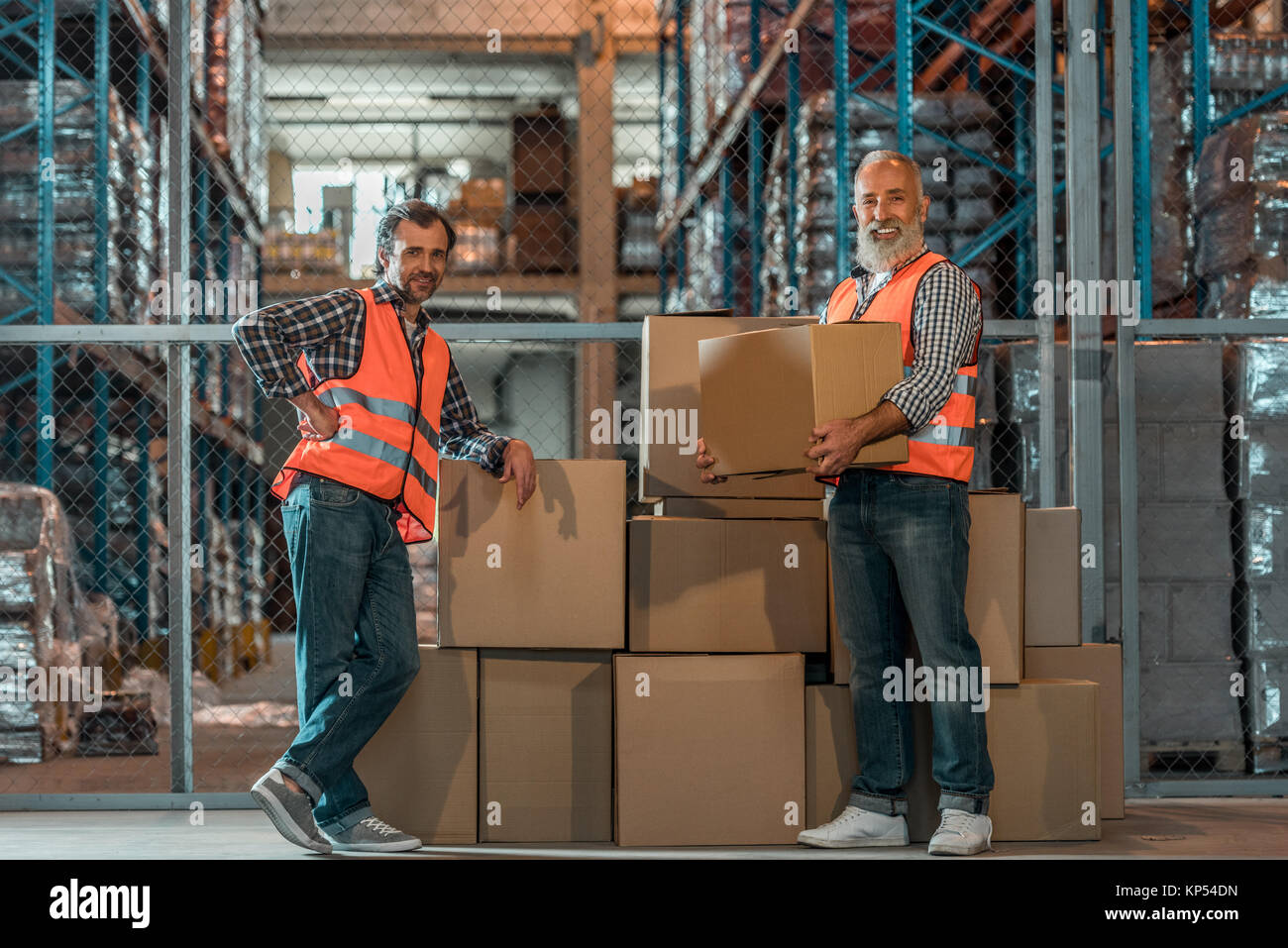 warehouse workers with boxes Stock Photo - Alamy