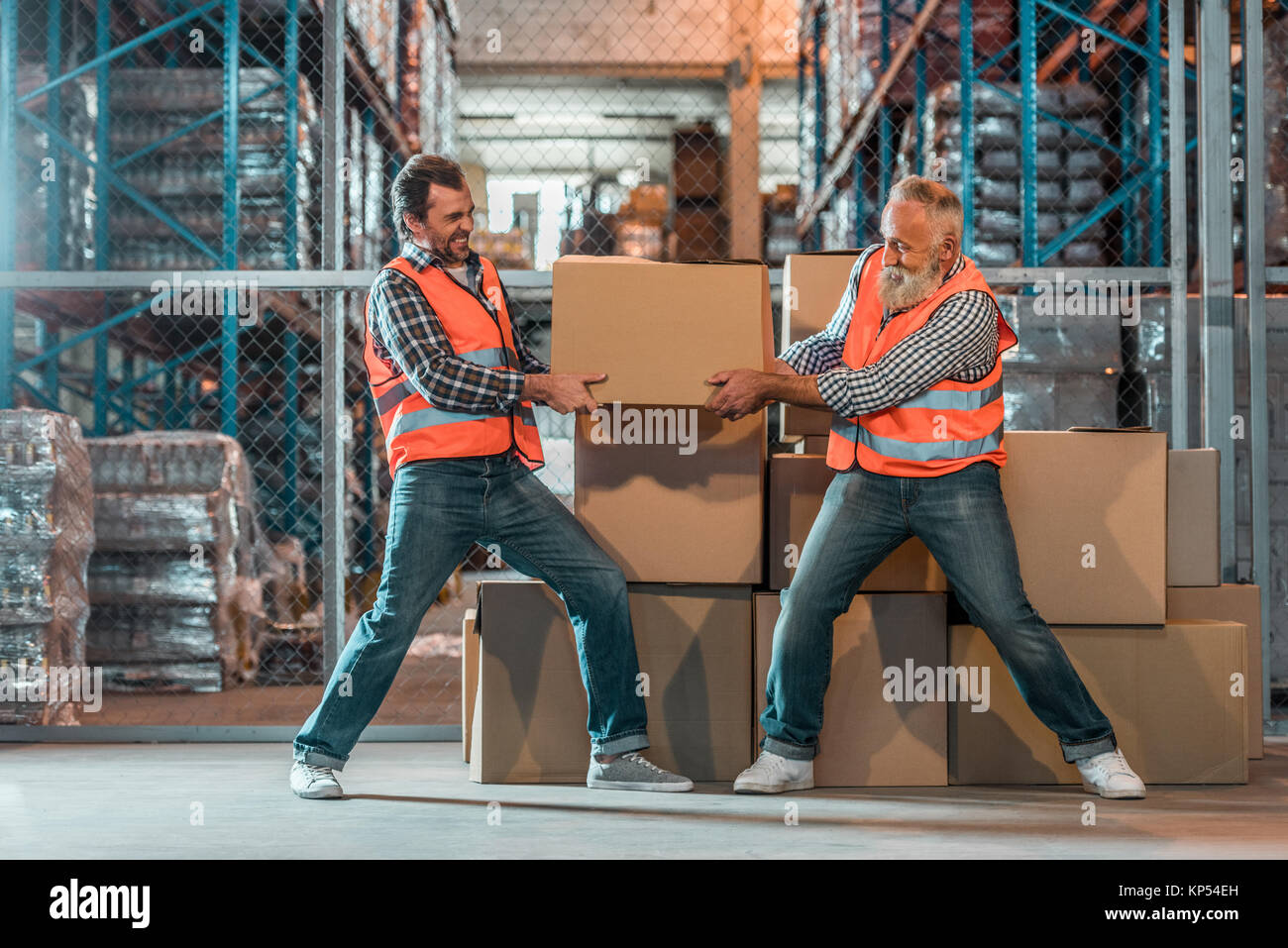 warehouse workers with boxes Stock Photo - Alamy