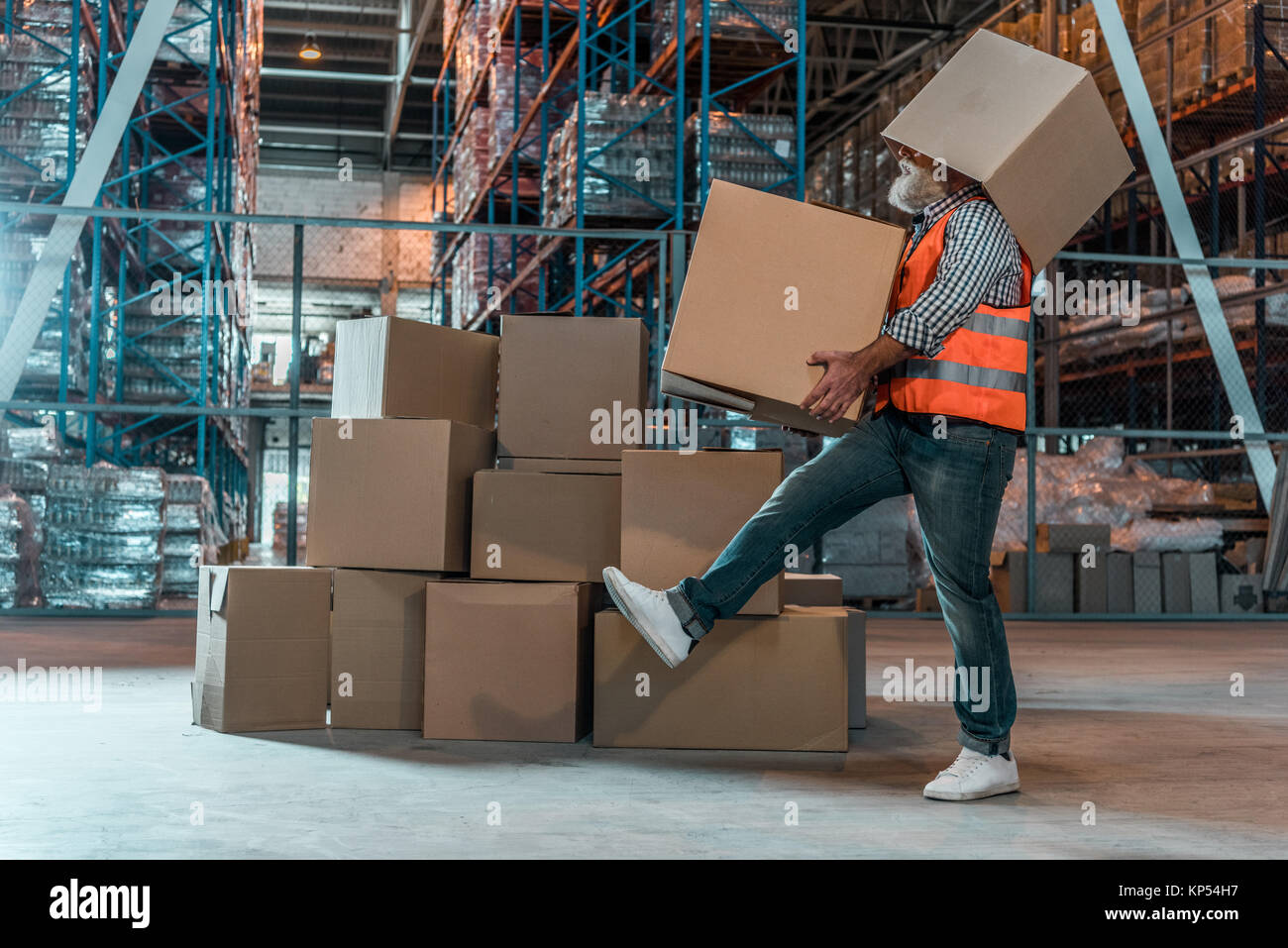 warehouse worker with boxes Stock Photo - Alamy
