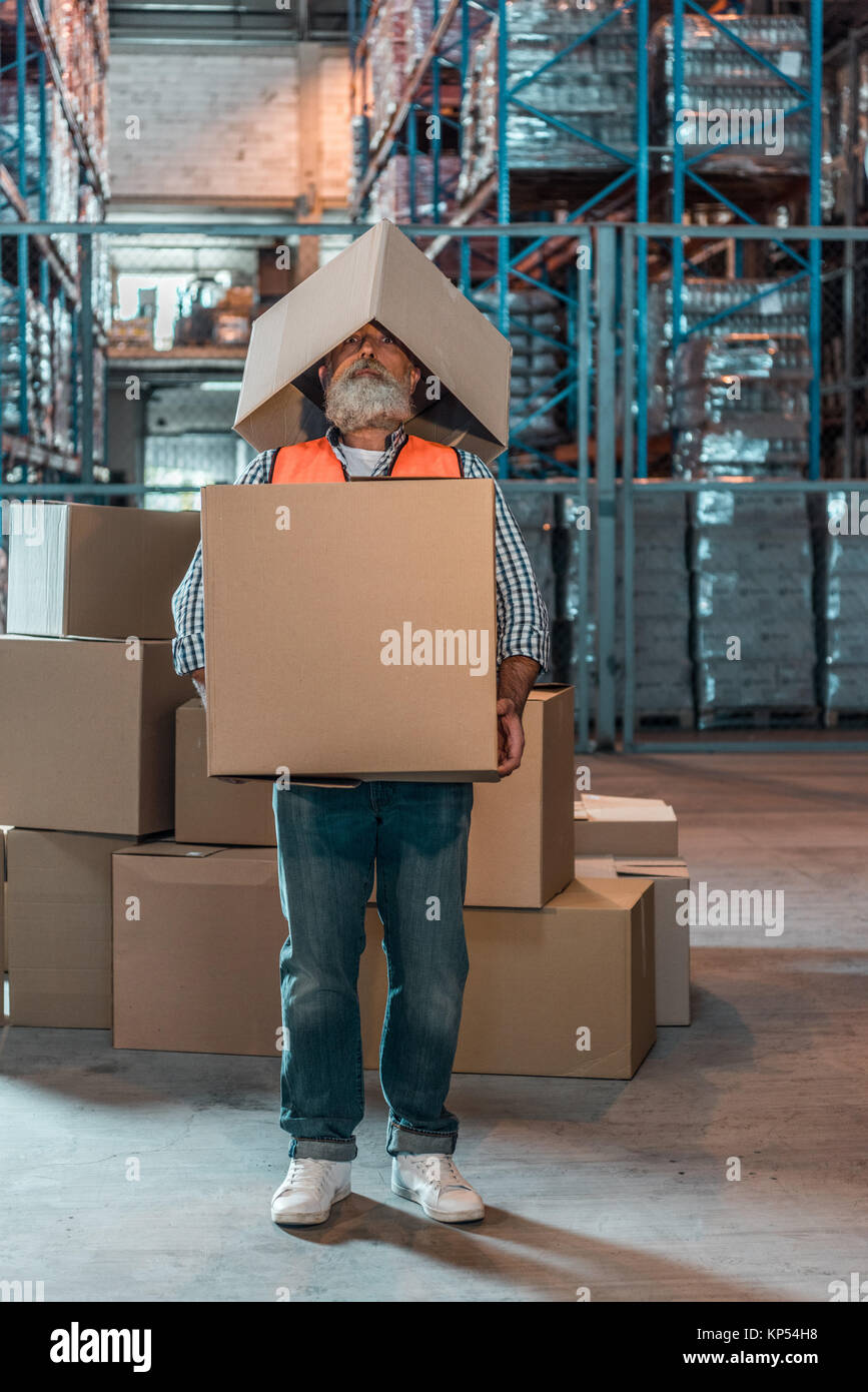 warehouse worker with boxes Stock Photo - Alamy