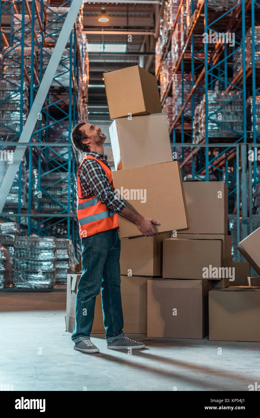 warehouse worker with boxes Stock Photo - Alamy