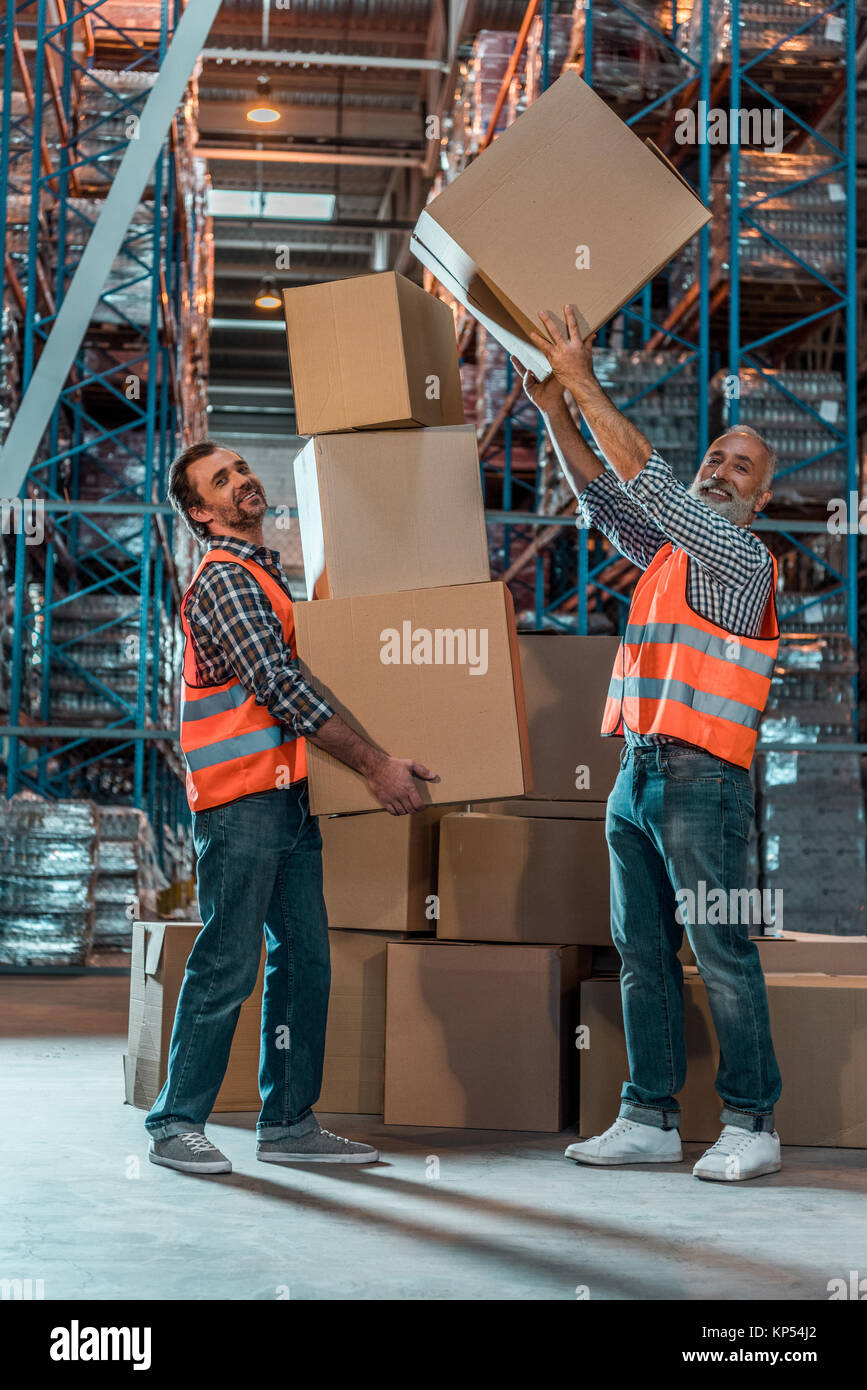 warehouse workers with boxes Stock Photo - Alamy