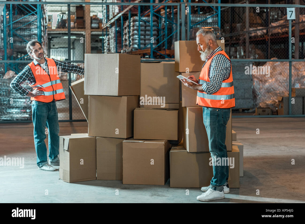warehouse workers with digital tablet Stock Photo - Alamy