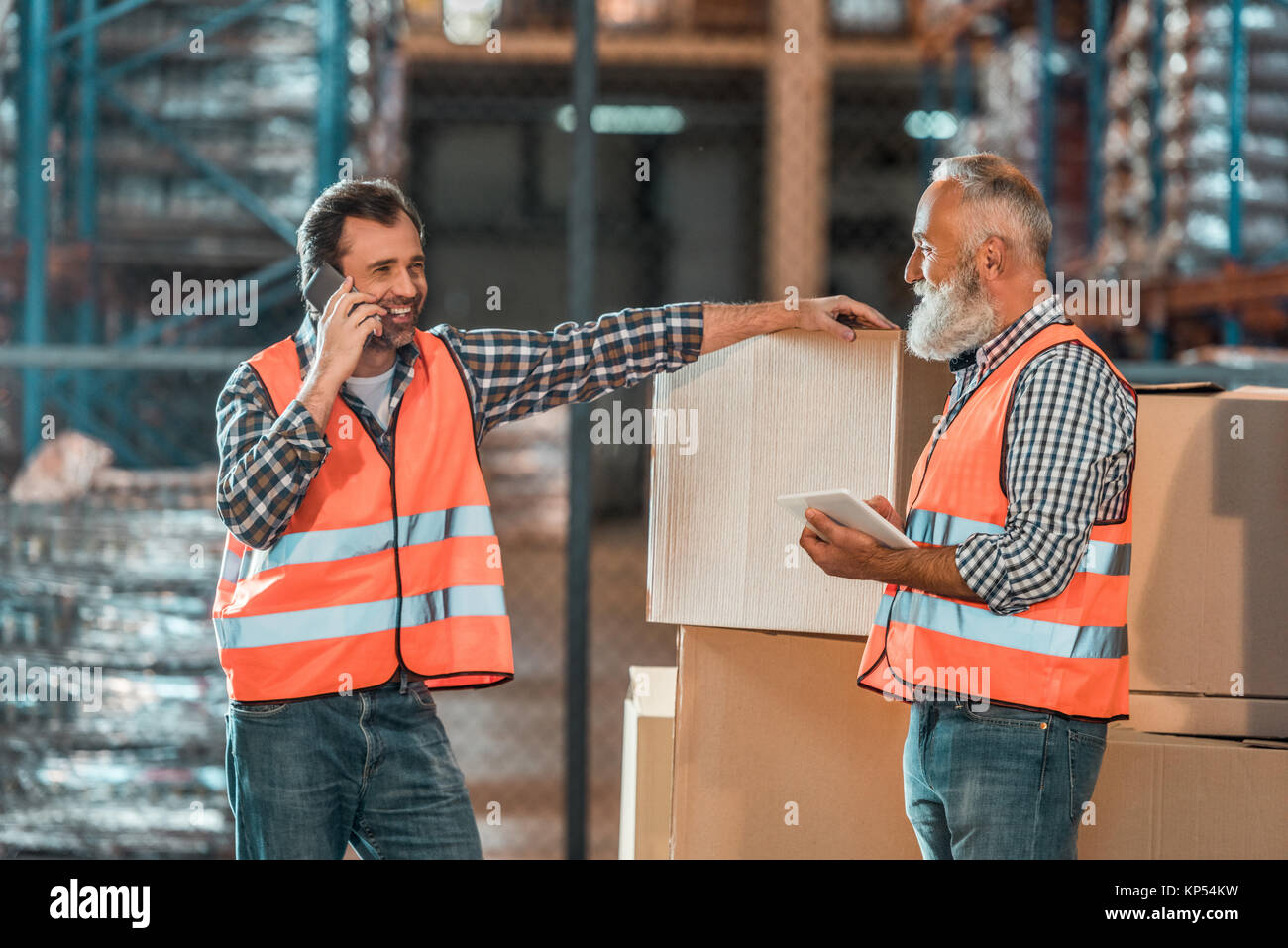 warehouse workers with digital devices Stock Photo - Alamy